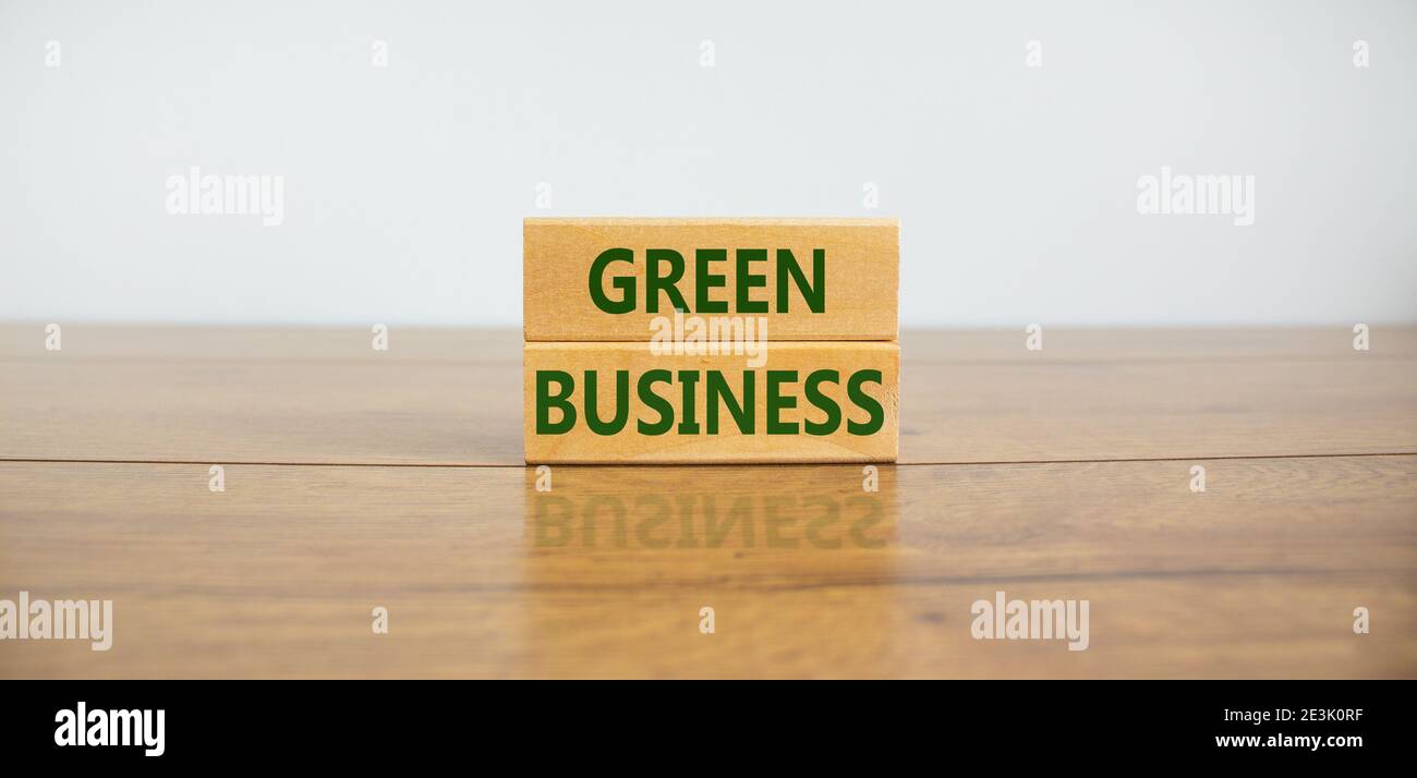 Green business symbol. Wooden blocks form the words 'green business' on ...