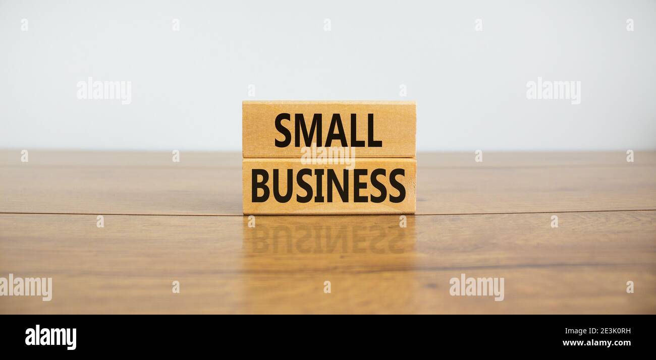 Small business symbol. Wooden blocks form the words 'small business' on ...