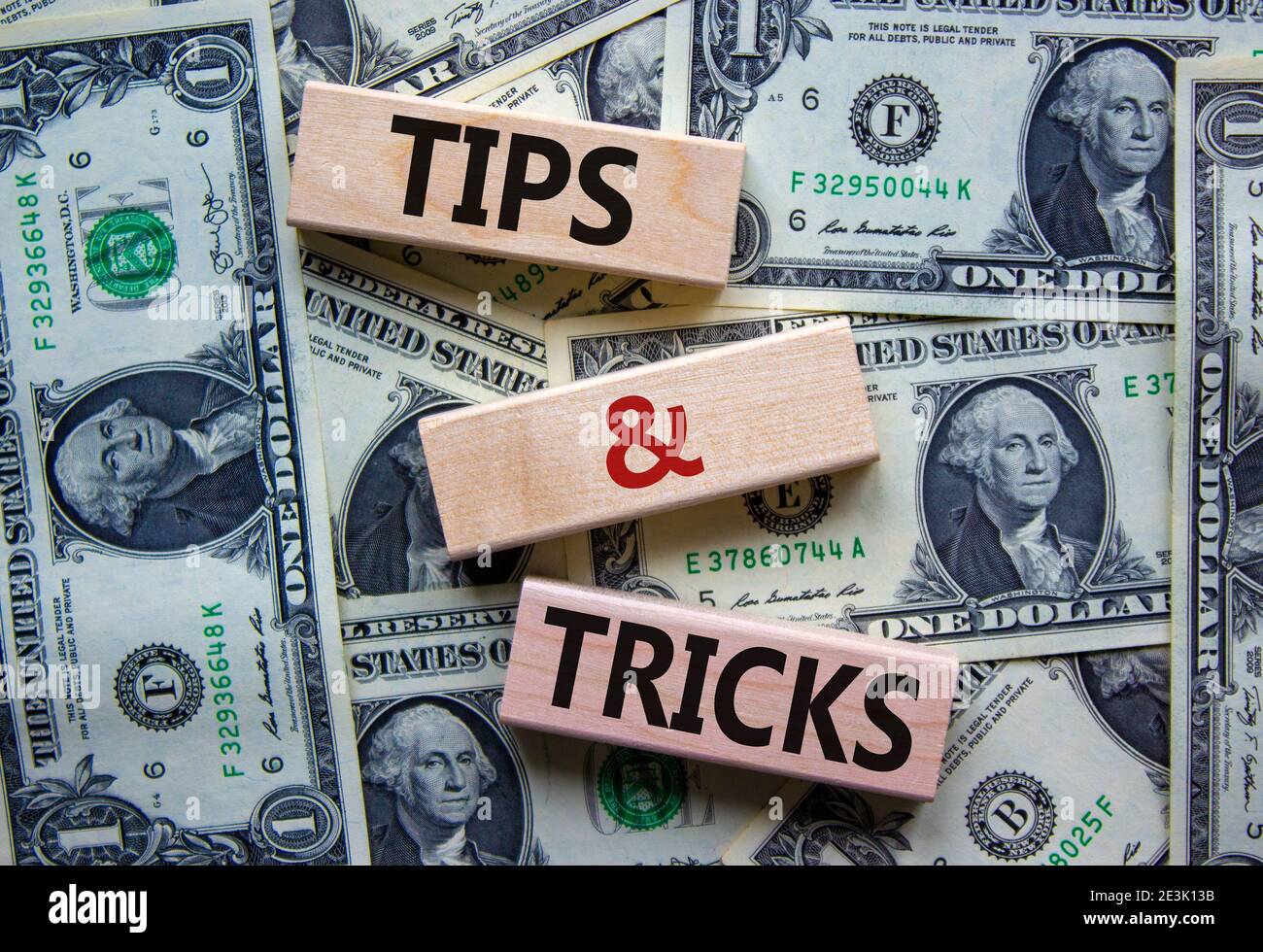 Tips and tricks symbol. Wooden blocks with words 'Tips and tricks'. Beautiful background from ...