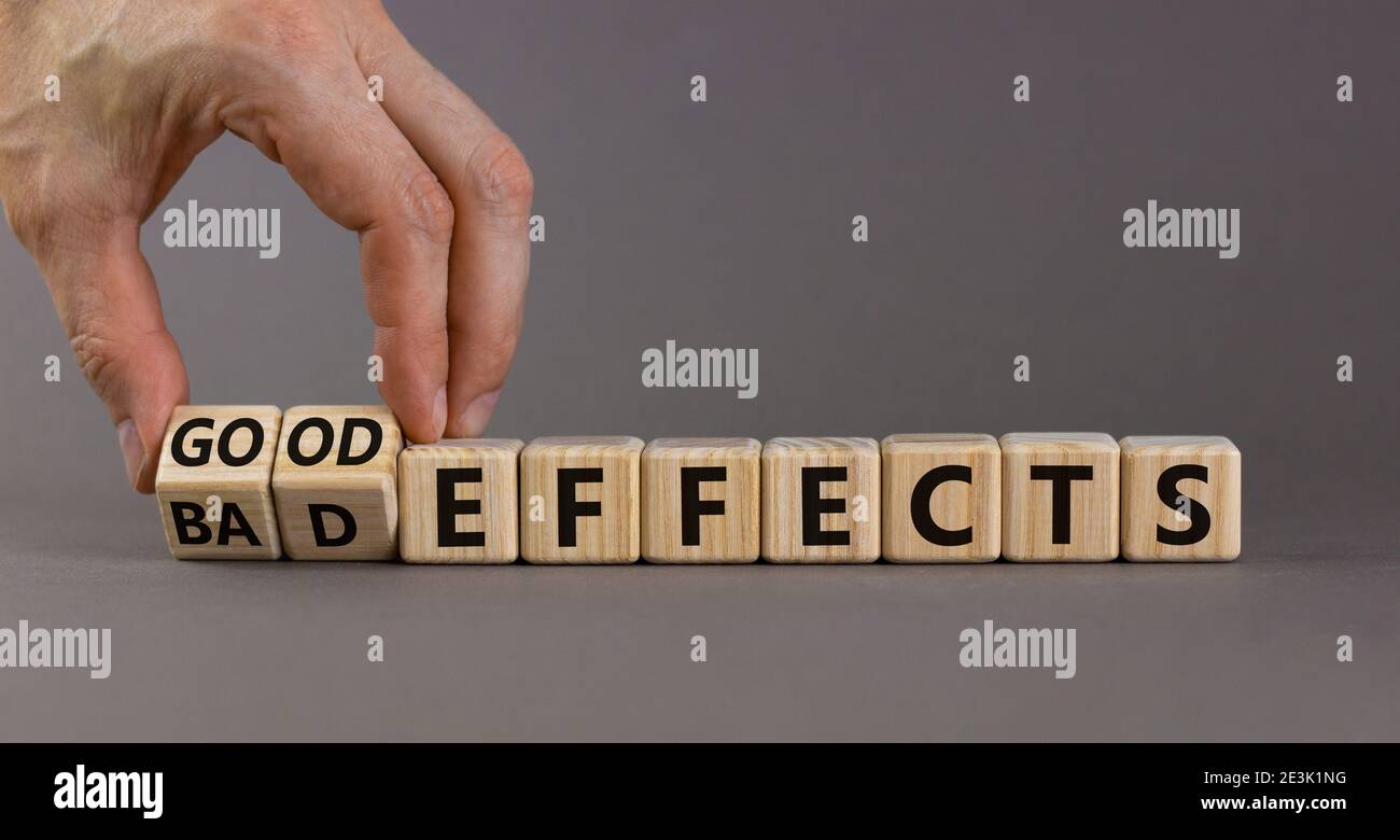 Bad or good effects symbol. Businessman turns wooden cubes and changes ...