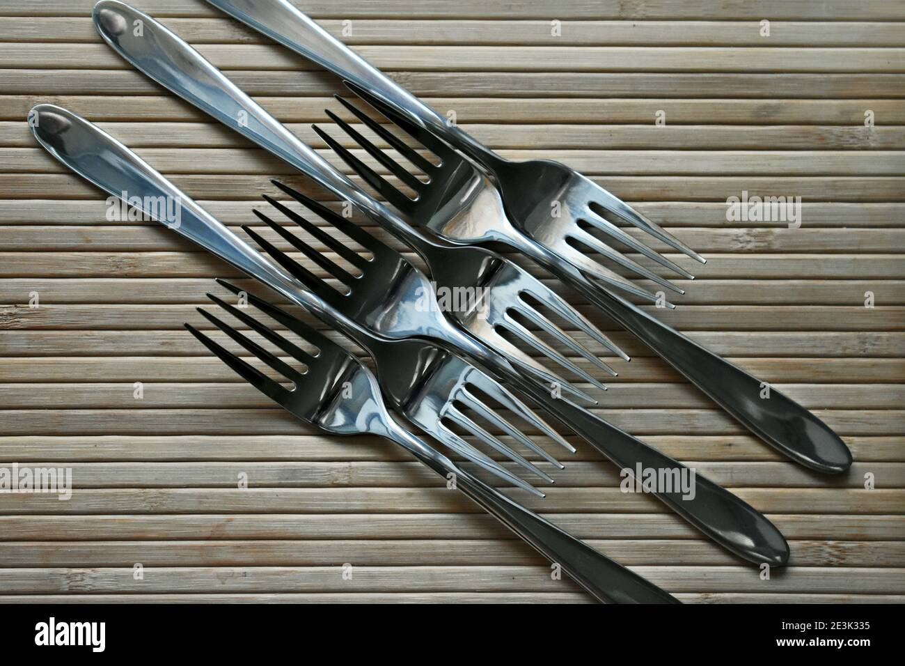 Forks on wooden surface hi-res stock photography and images - Alamy