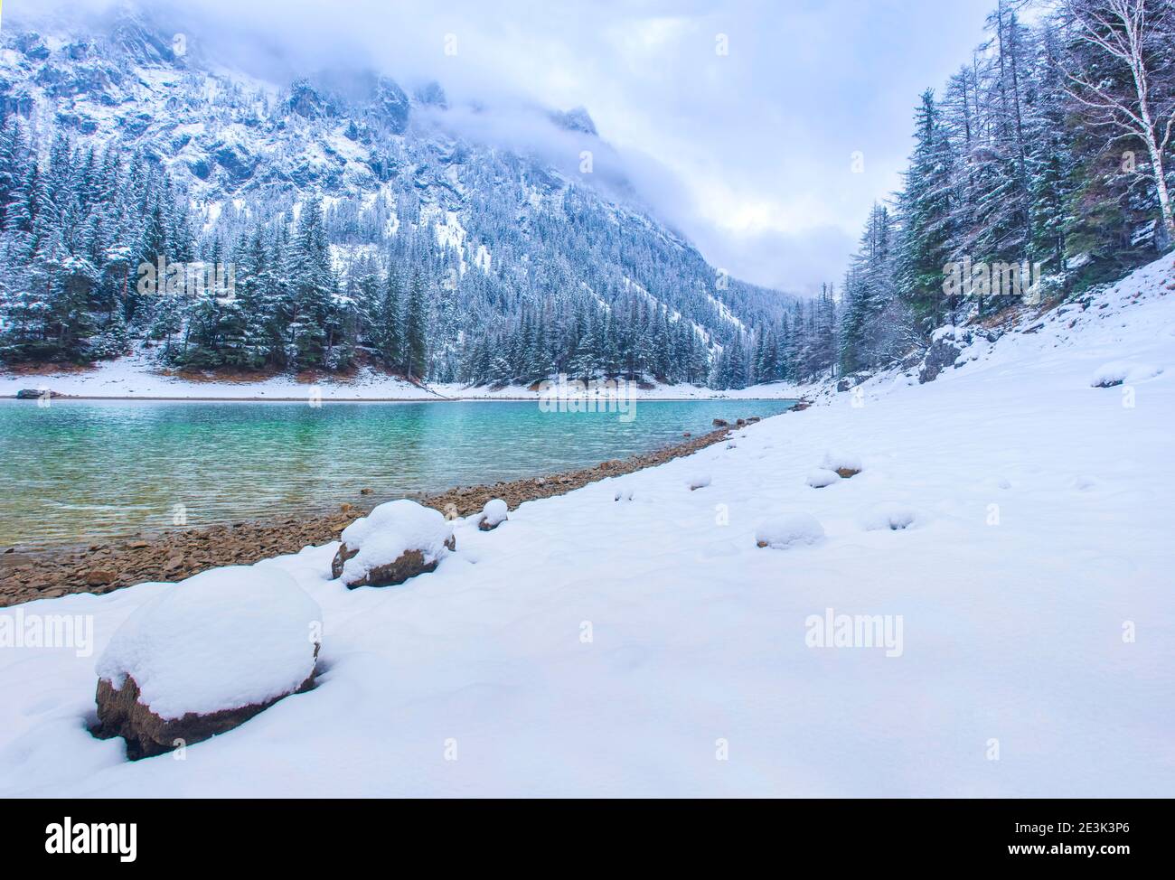 Amazing winter landscape with snowy mountains and clear waters of Green ...