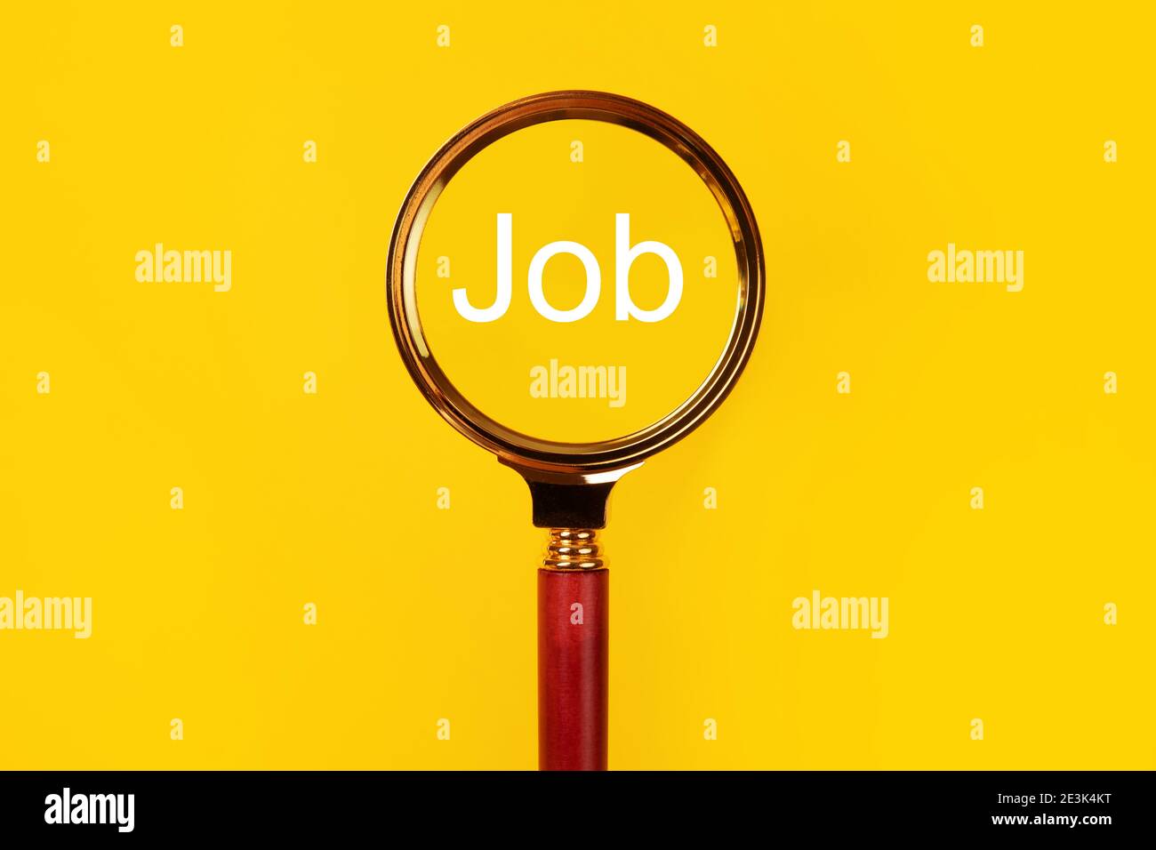 magnifier on yellow background, job search concept Stock Photo - Alamy