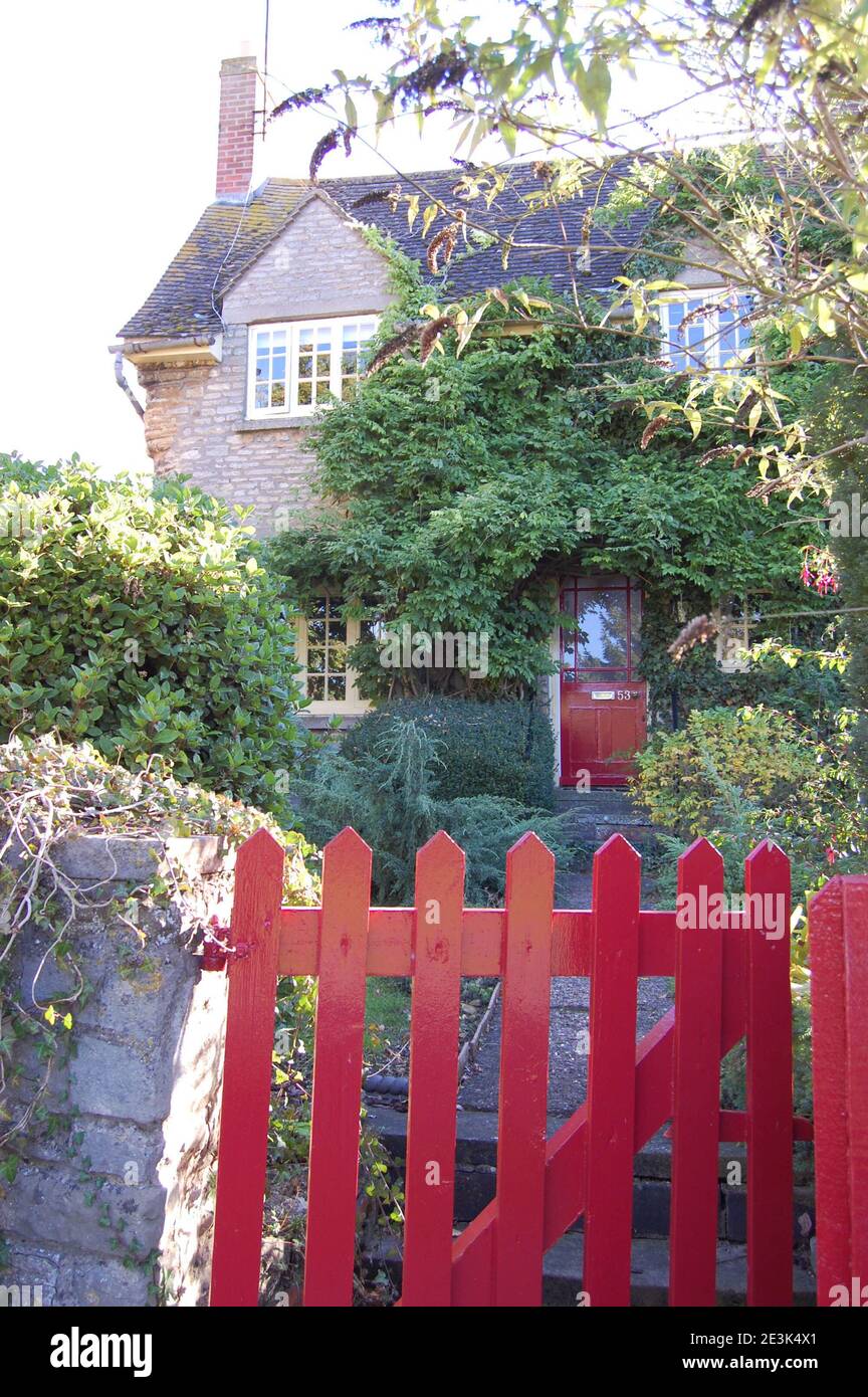 Red gate and cottage Yardley Hastings Northamptonshire England Stock ...