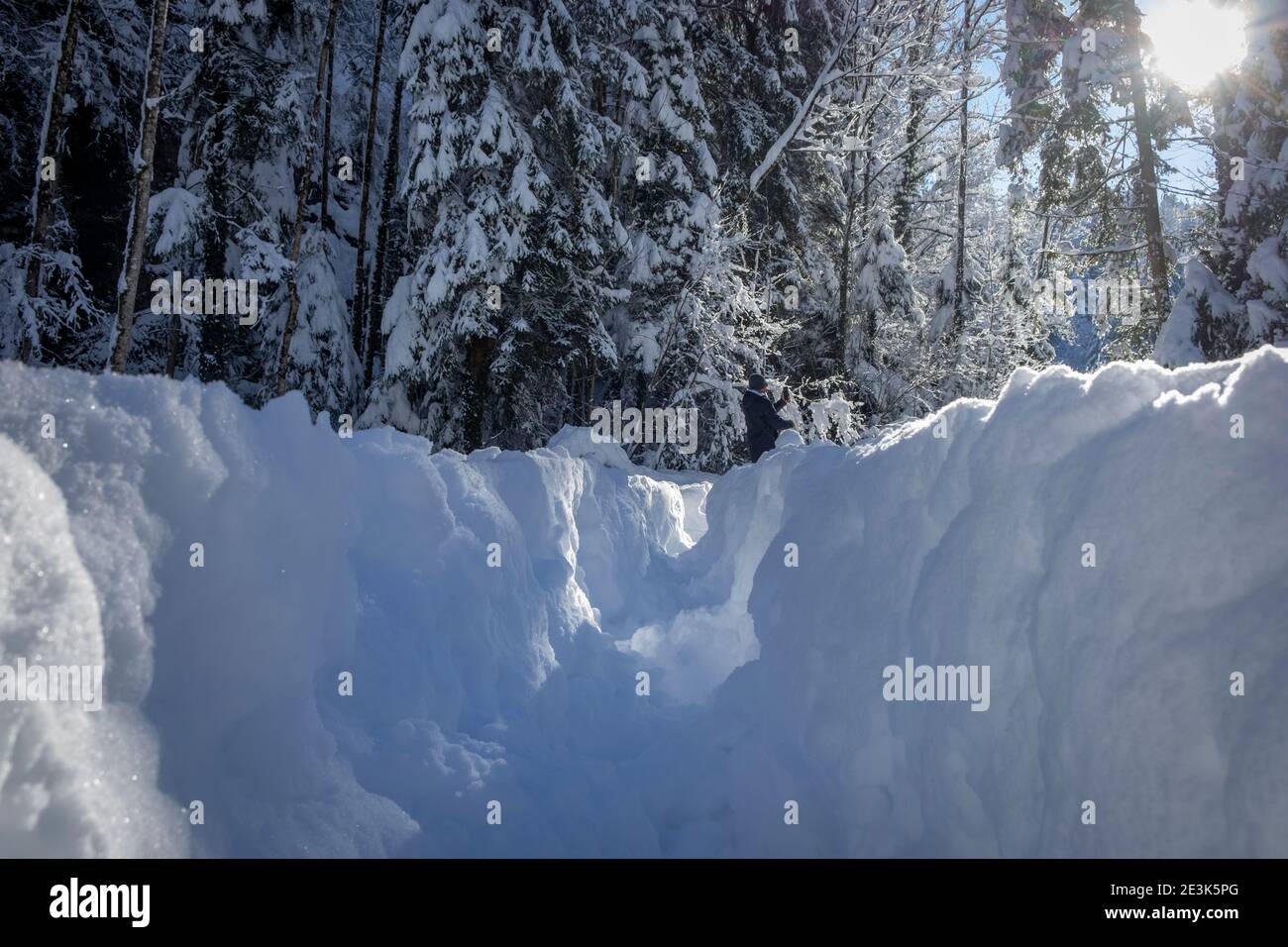 Snow walking beside the river Frutz at waterfall Rotes Tor in Rankweil ...
