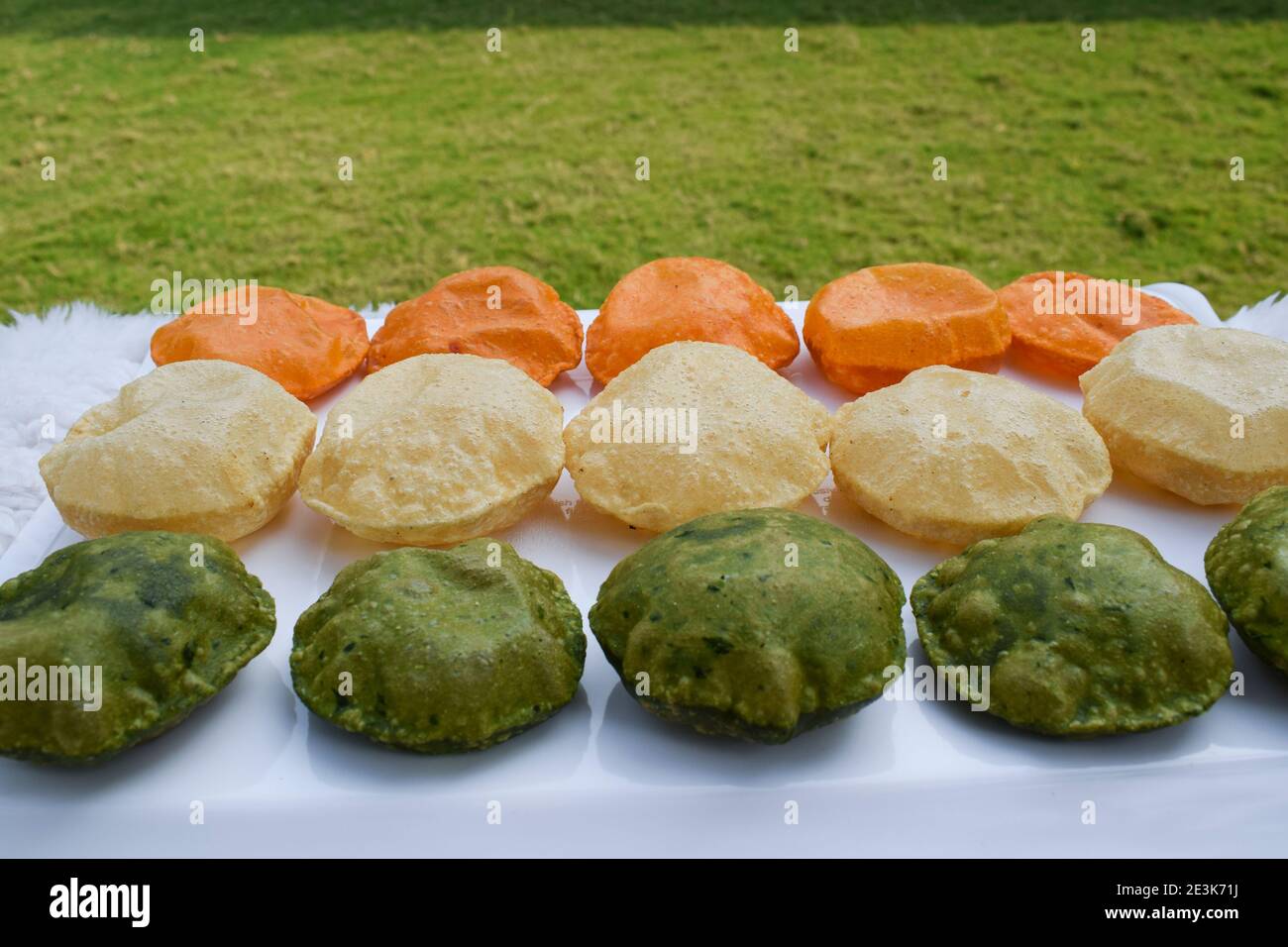 India tricolor / tricolour food breakfast of spinach puri, carrot puri ...