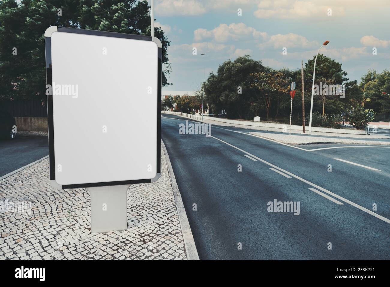 A mockup of a blank vertical ad banner on the paving-stone; the ...