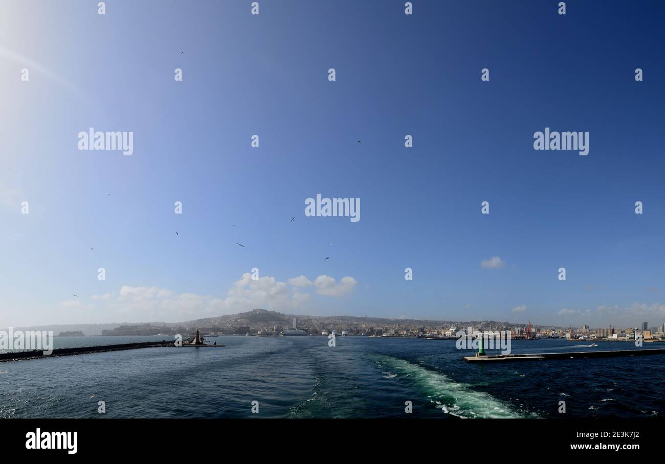 large port with lighthouse at the exit of ship panorama Stock Photo - Alamy