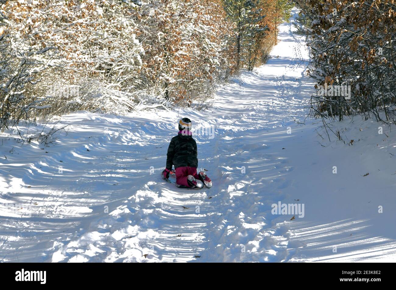 People sliding down ice slide hi-res stock photography and images - Alamy