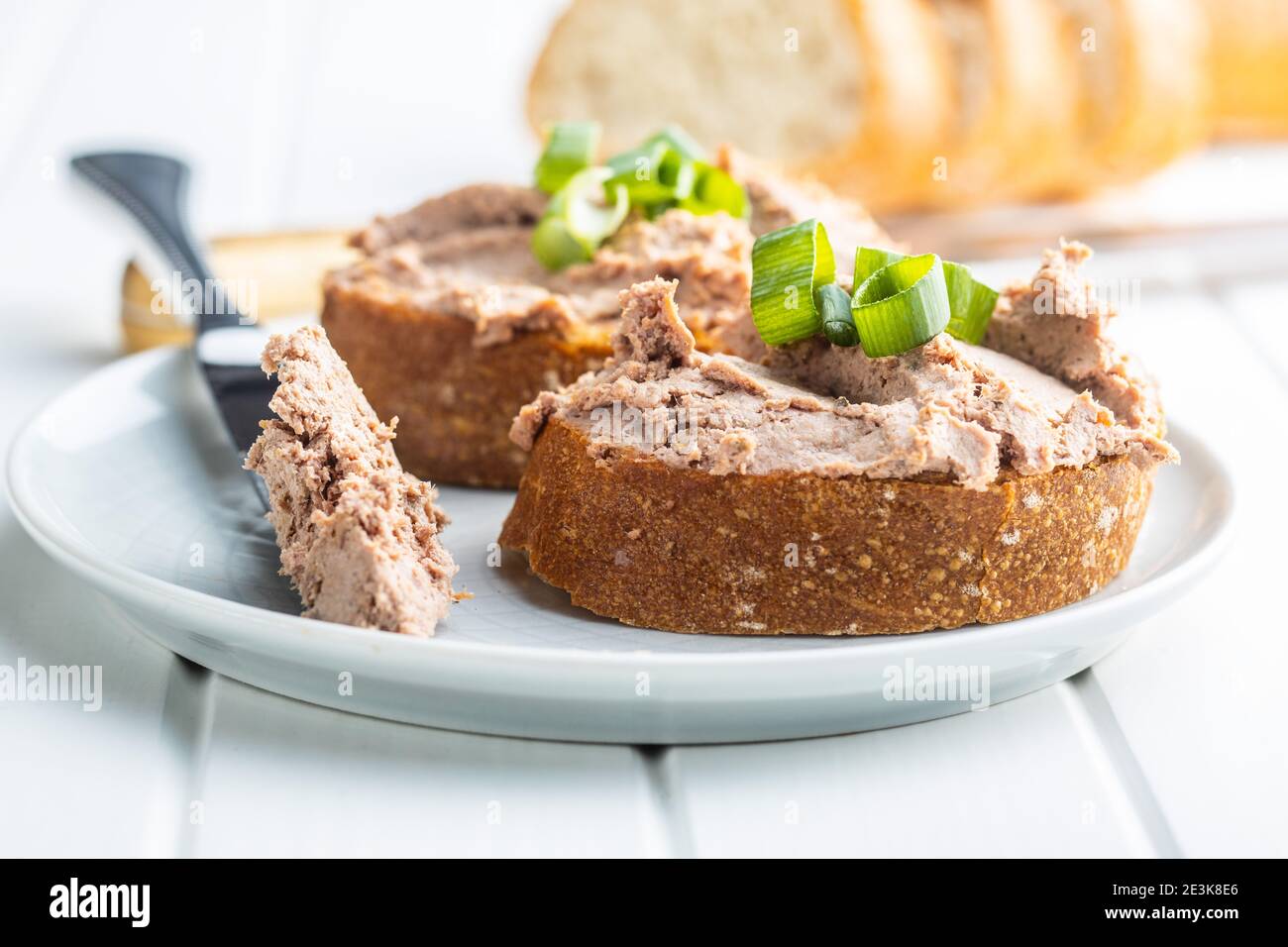 Liver pate on sliced baguette on plate Stock Photo - Alamy