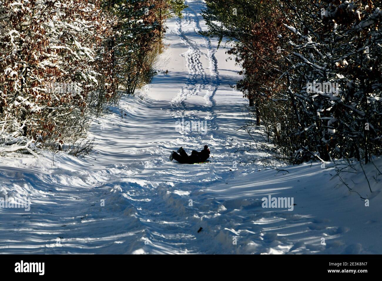 People sliding down ice slide hi-res stock photography and images - Alamy