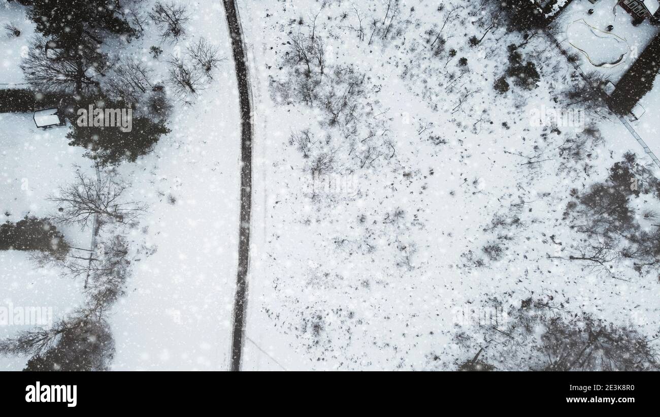 Aerial top view of a foot path in winter , surrounded by snow. Kanata ...