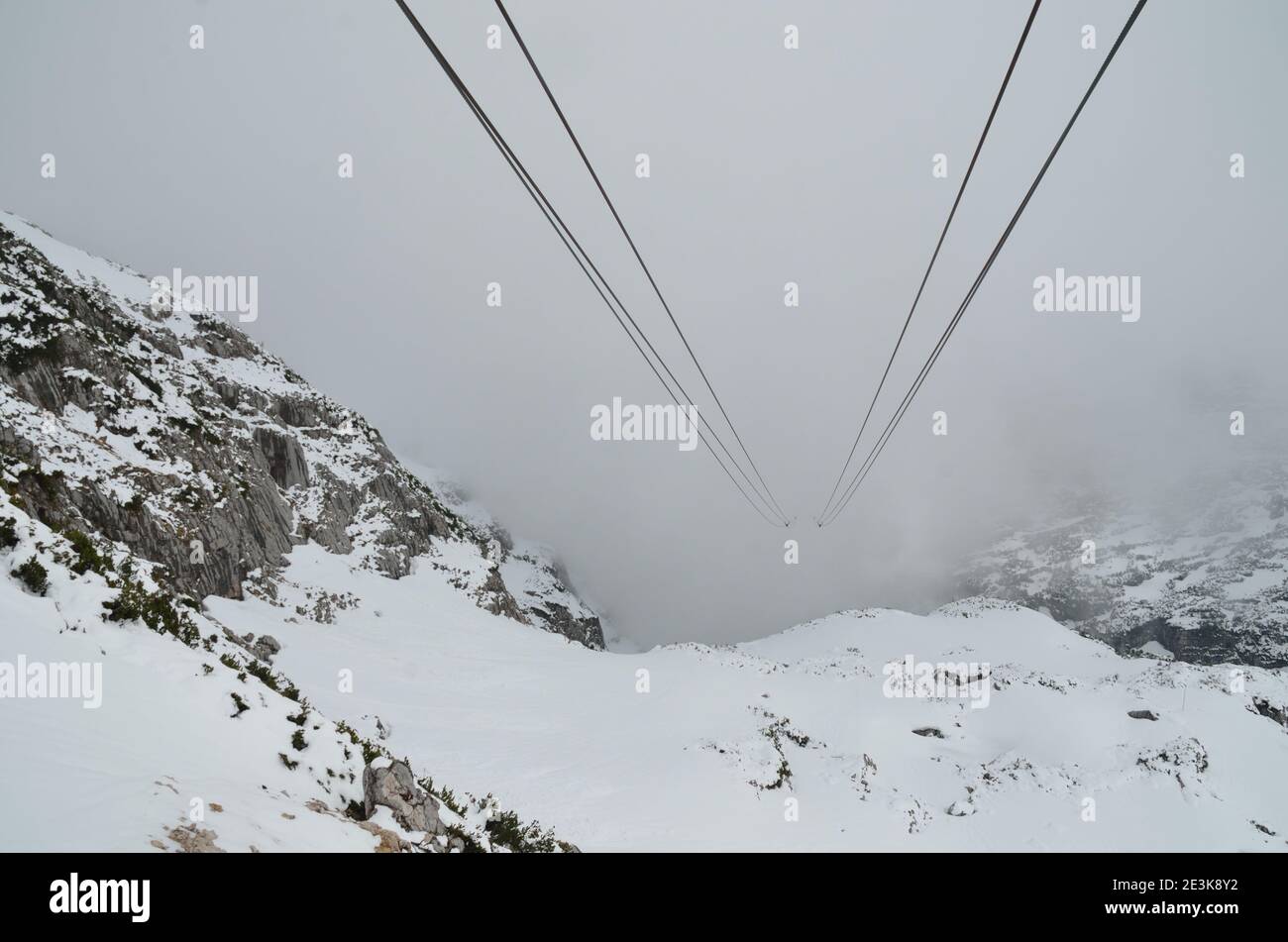 cableway in the mountains with snow and thick fog Stock Photo - Alamy