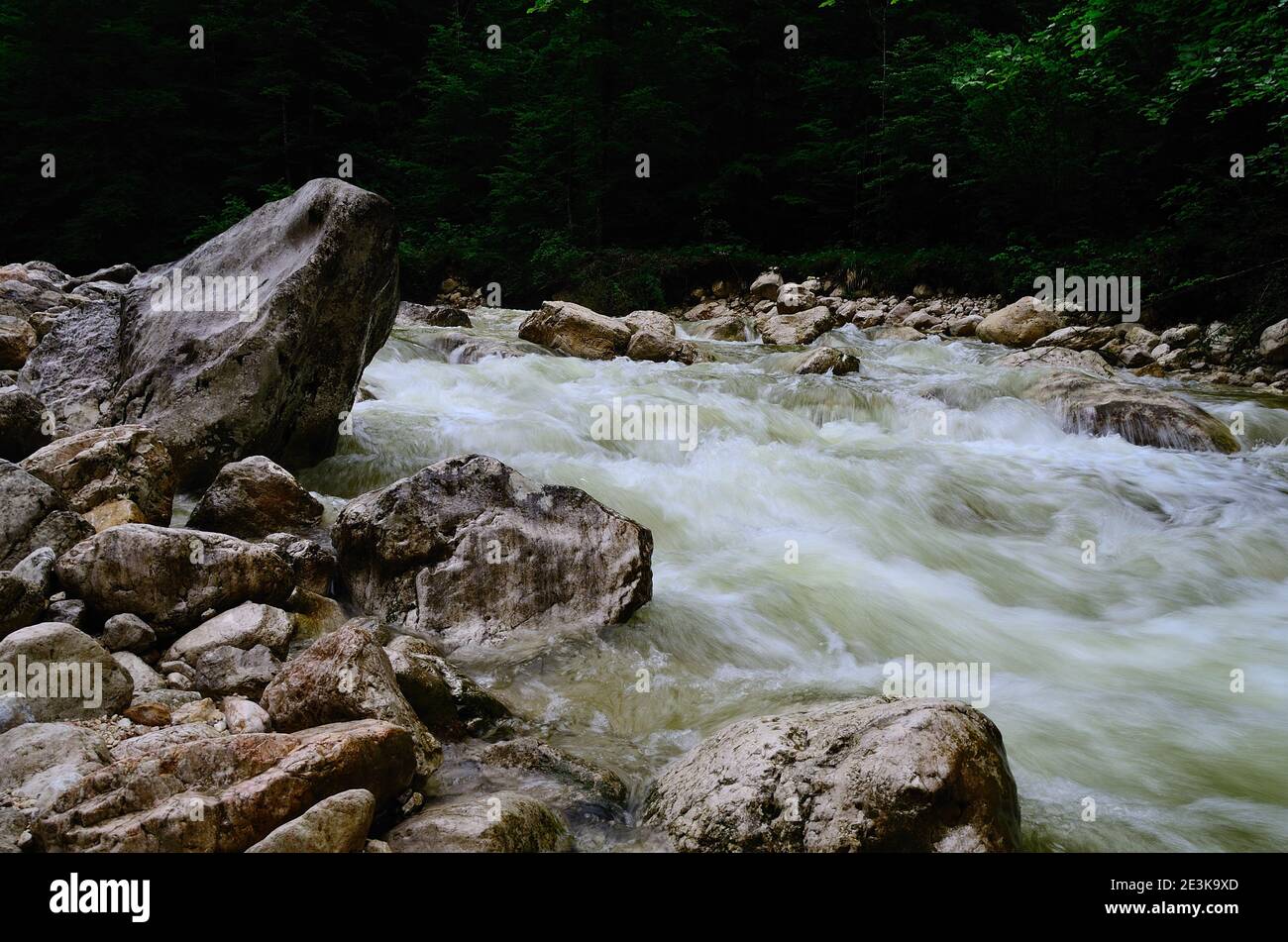 cold river with white water and many rock Stock Photo - Alamy