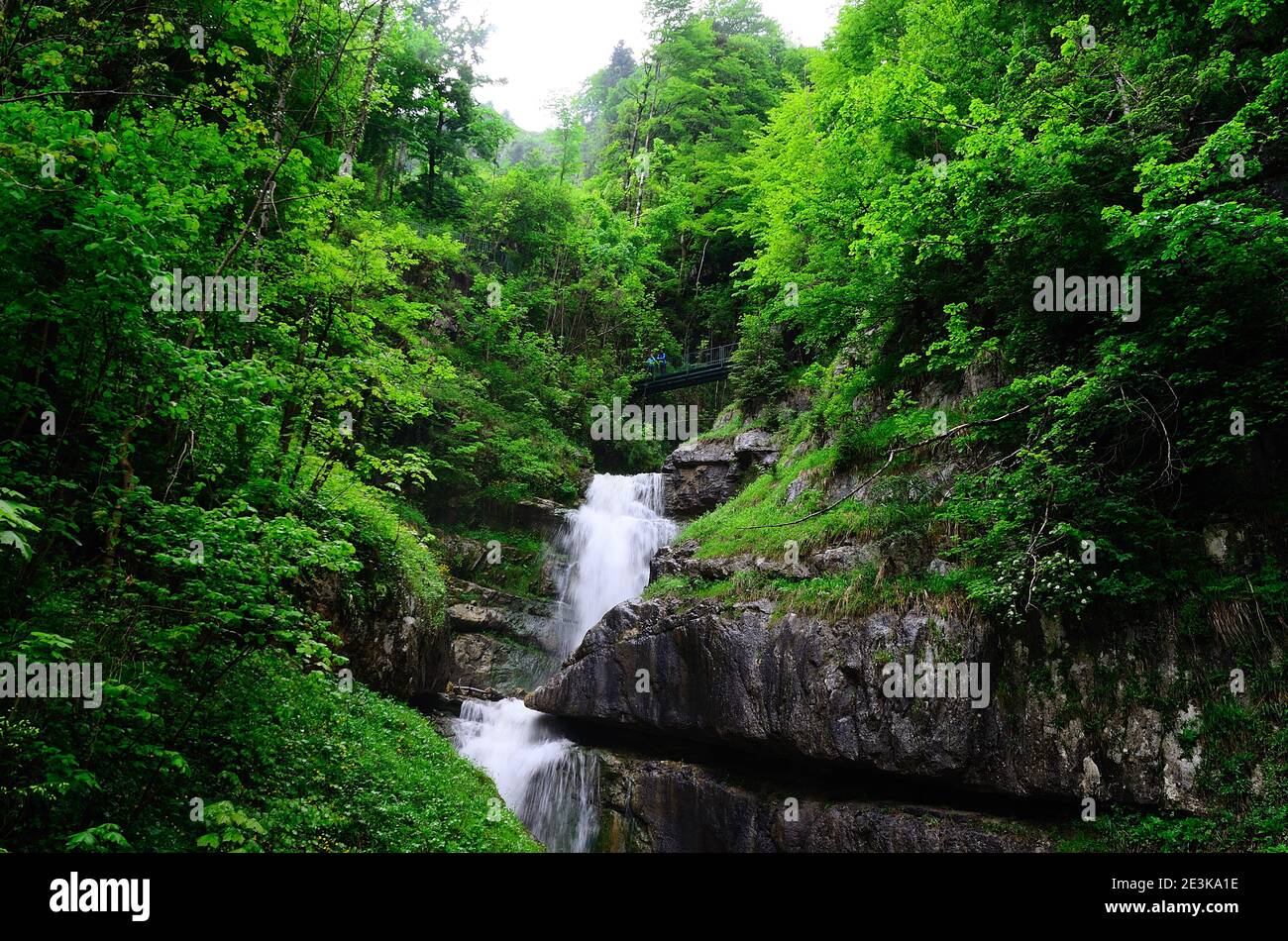 high waterfall and bridge in the mountains Stock Photo - Alamy