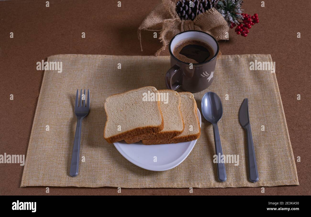drinking coffee with bread, creating new ideas at my desk Stock Photo ...