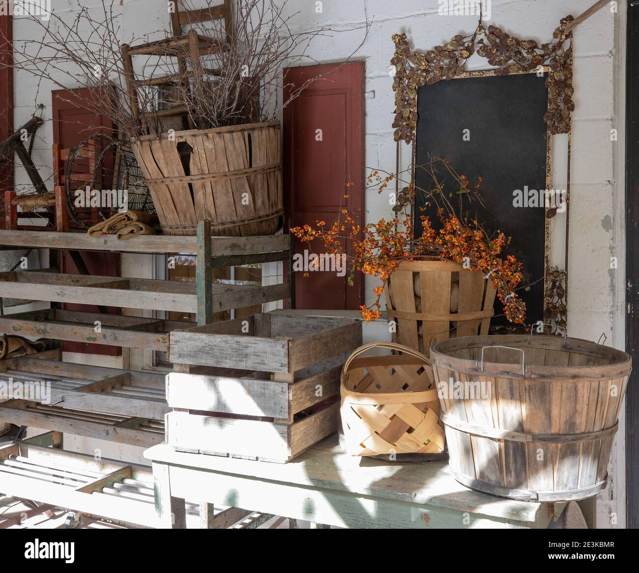 Old rustic antiques on display outside an old building Stock Photo - Alamy