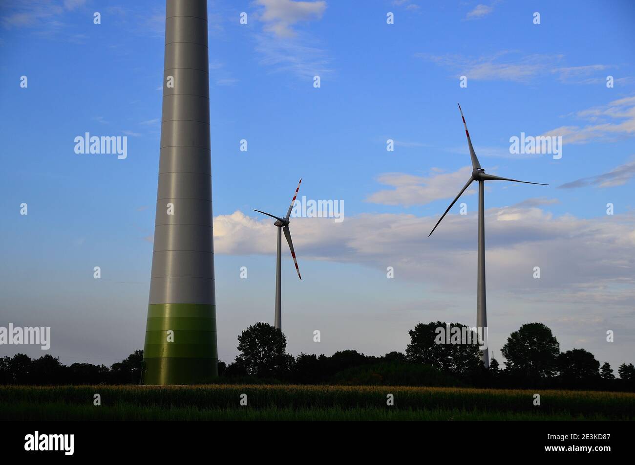three windmills in green nature Stock Photo - Alamy