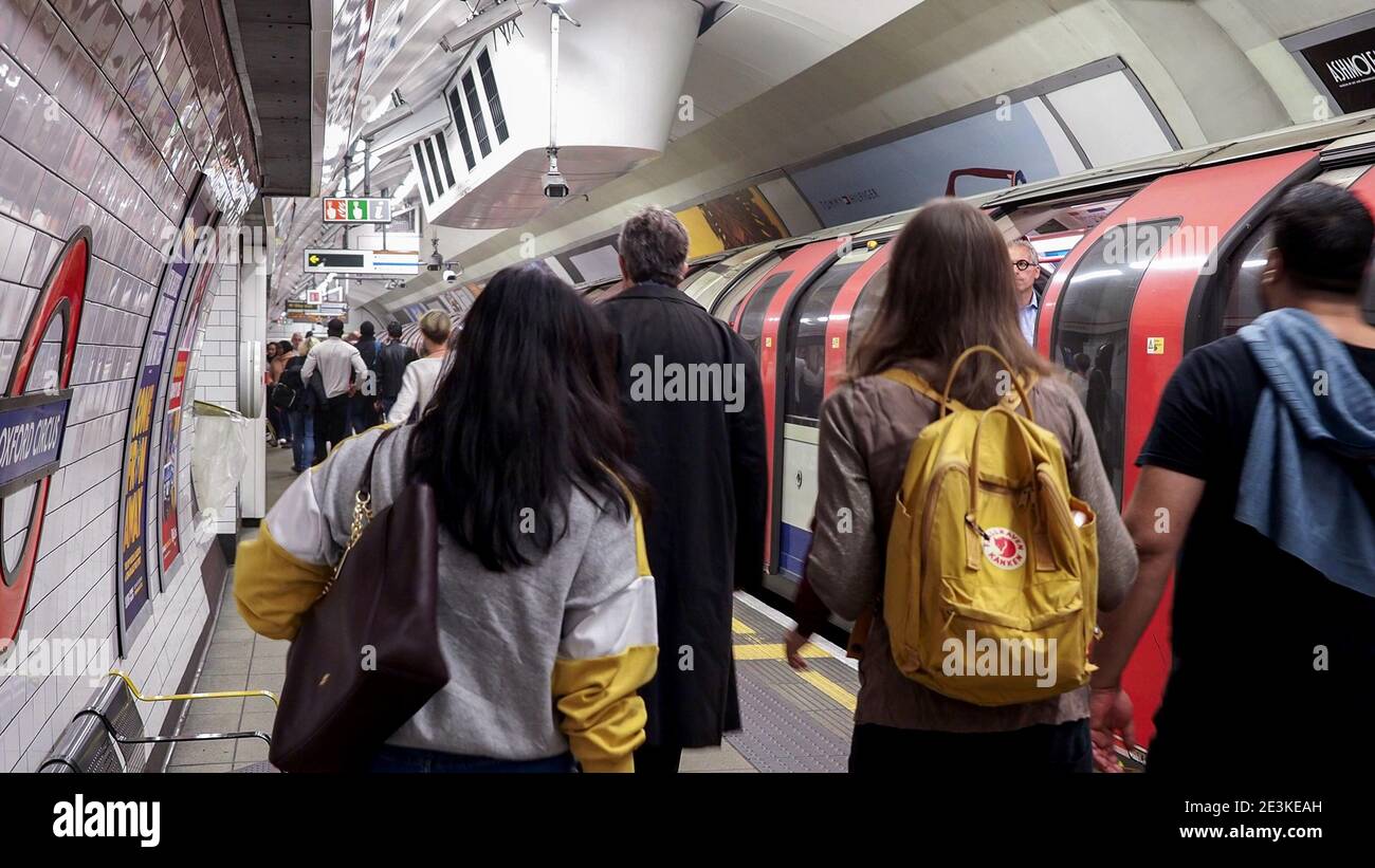 LONDON, UK - CIRCA SEPTEMBER 2019: passengers boarding and alighting ...