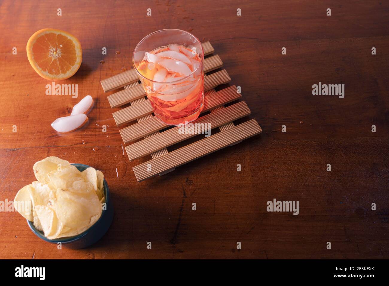 Spritz with some chips on the table are ready for the aperitif during ...