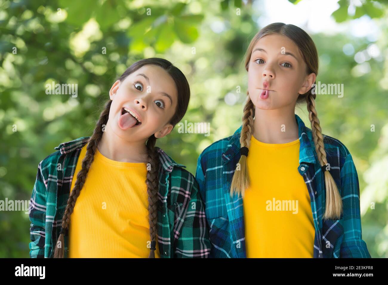 Grimacing mouths. Funny children have fun outdoors. Playing games ...
