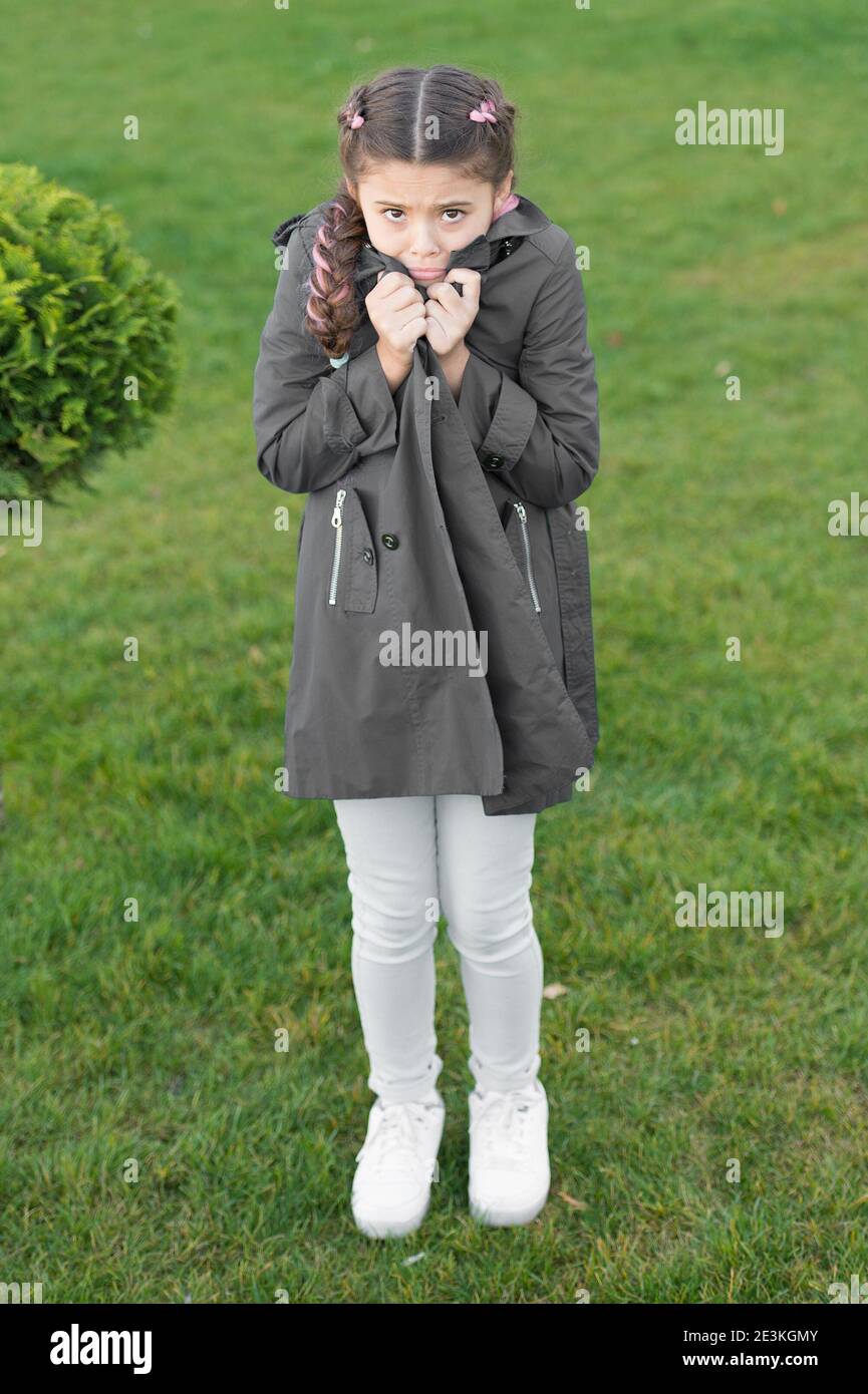 Girl cute face braided hair posing coat in spring park. Clothing for ...