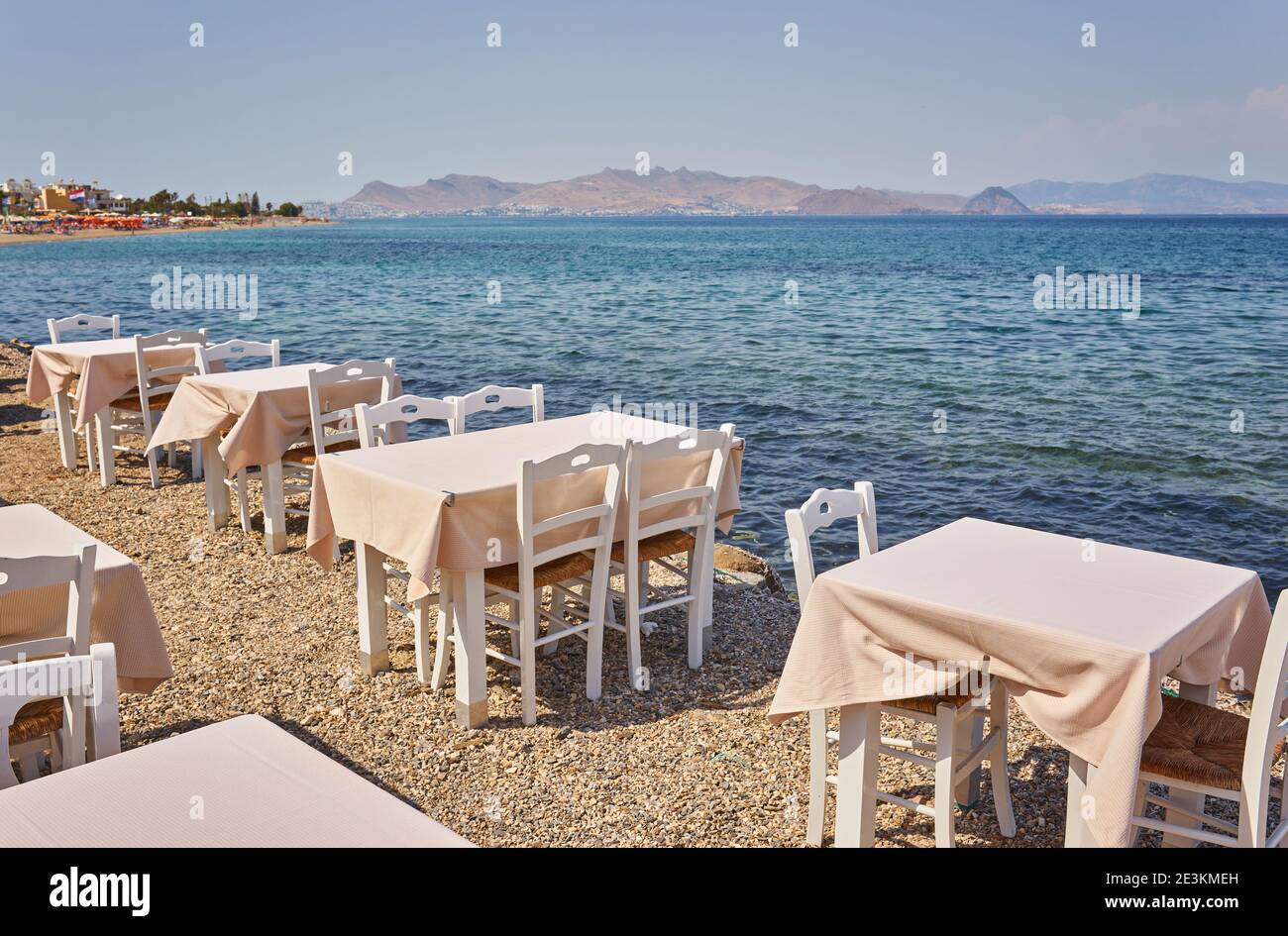 Greek beach with traditional blue tables and chairs, Greece Stock Photo ...