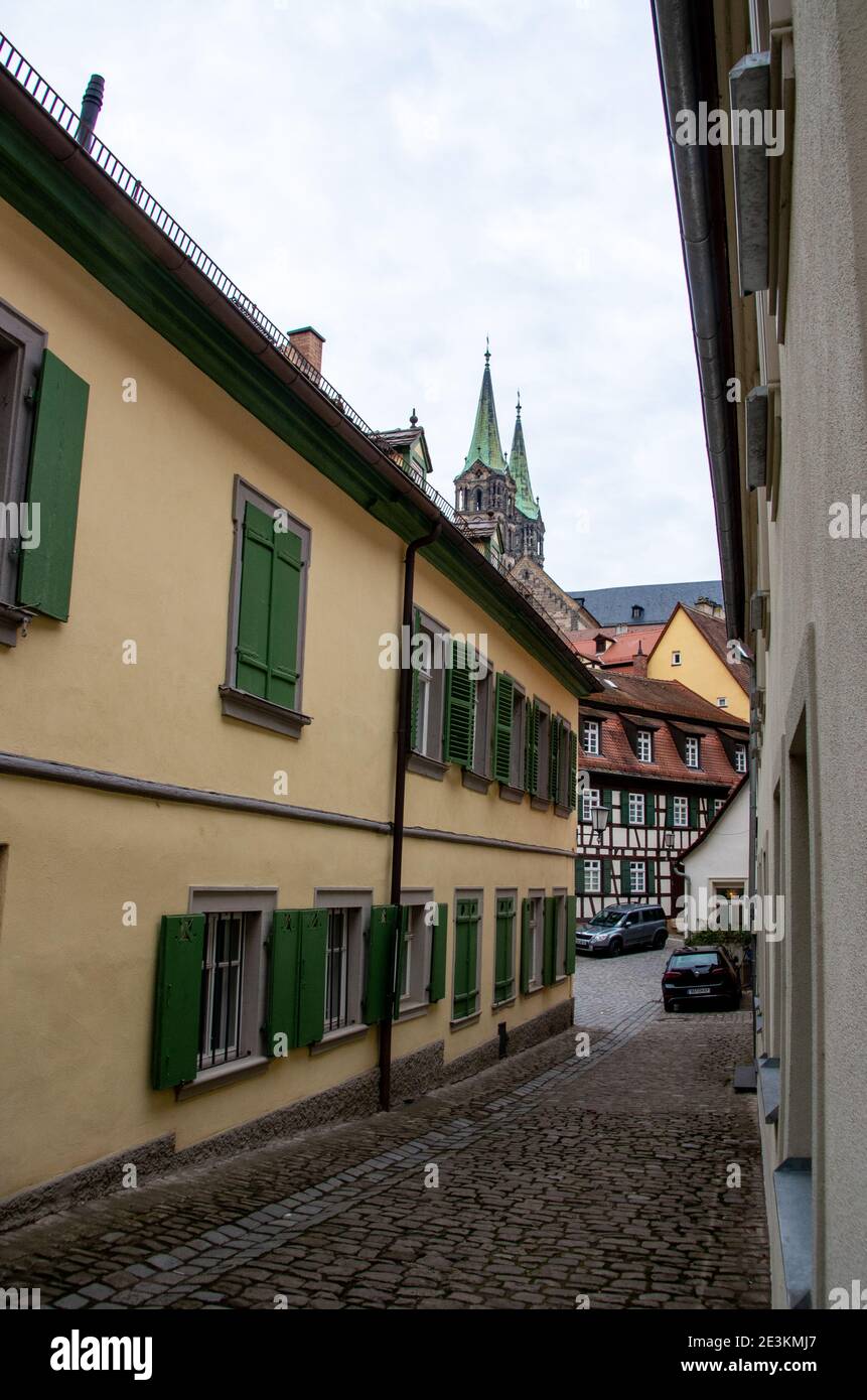 View into a narrow alley of the World Heritage city of Bamberg with the ...