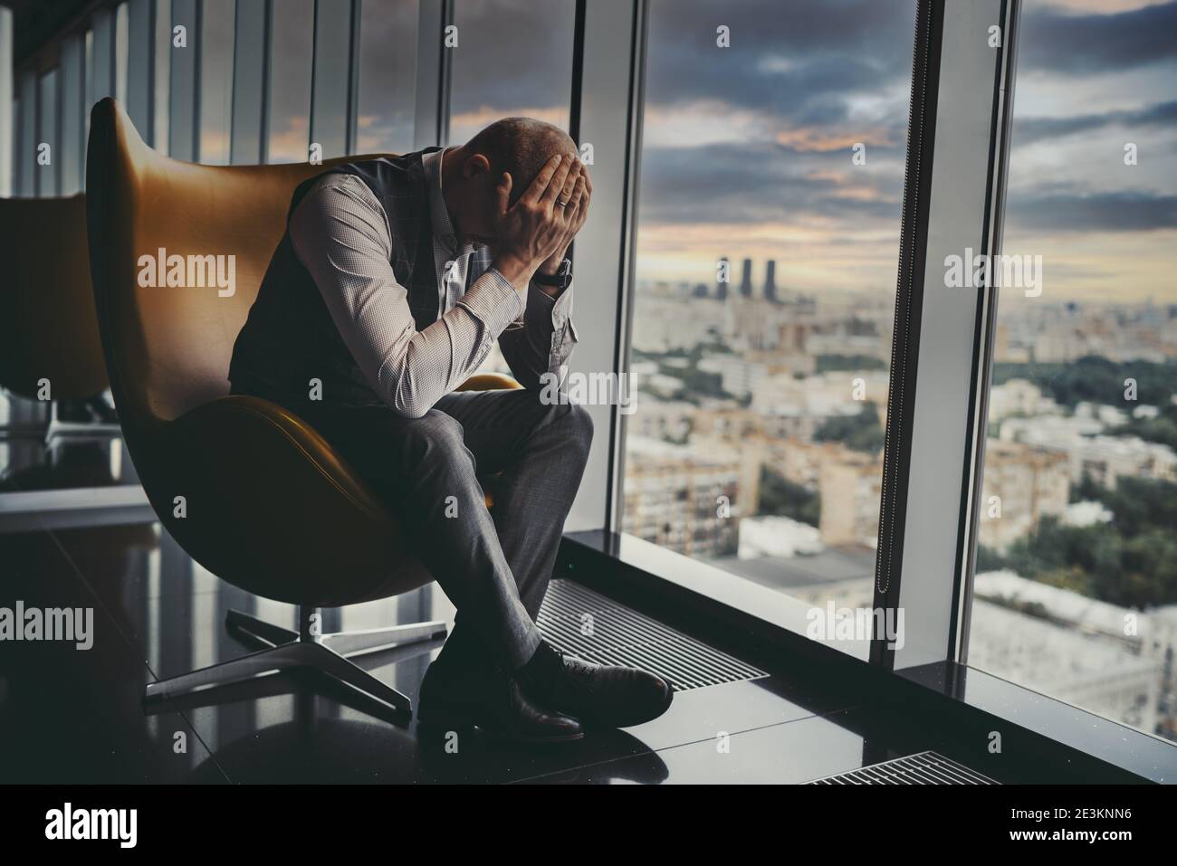 A tired broken man entrepreneur is worrying about the crisis and ...