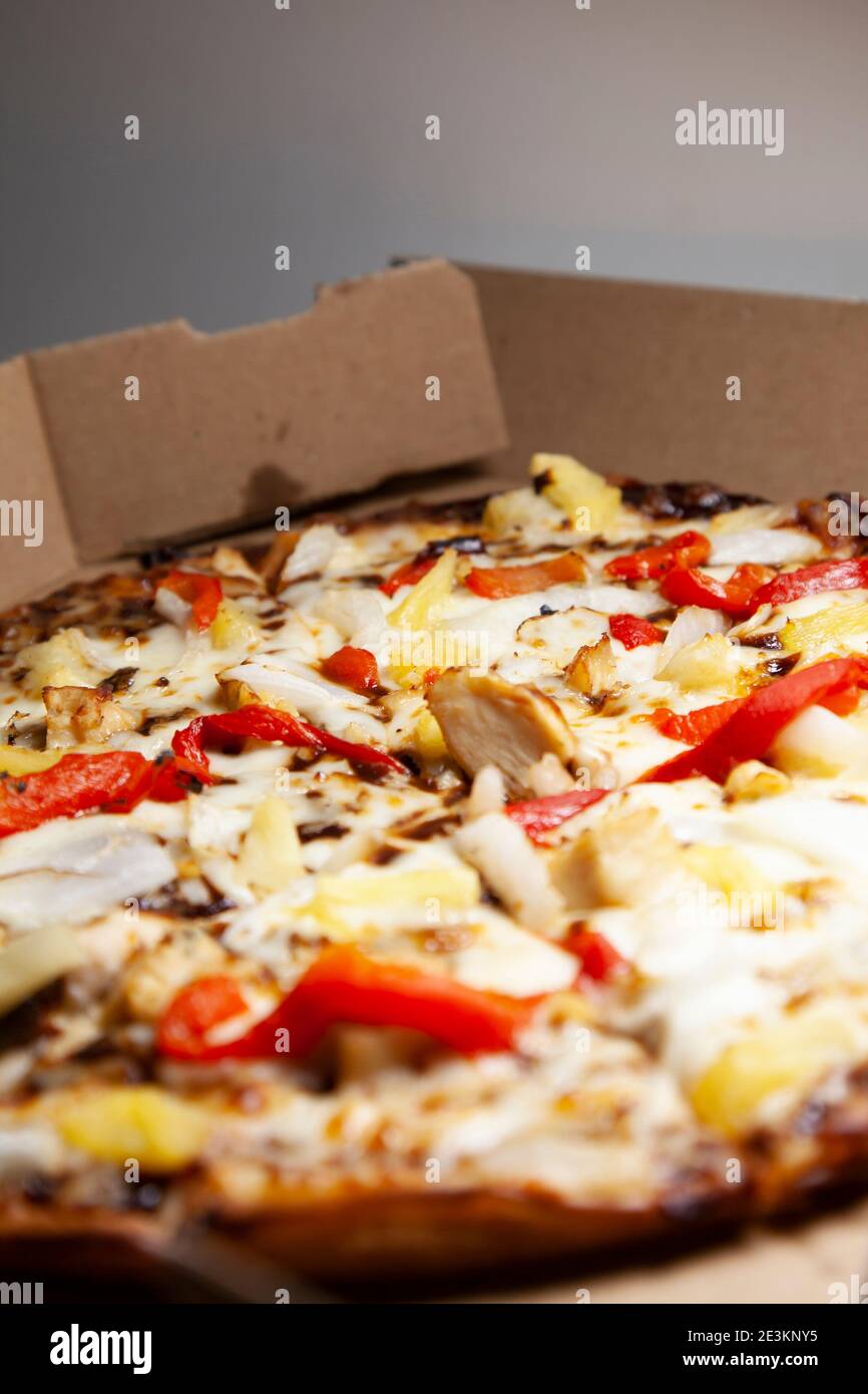 Barbeque chicken, red bell pepper, onion, pineapple pizza in its ...