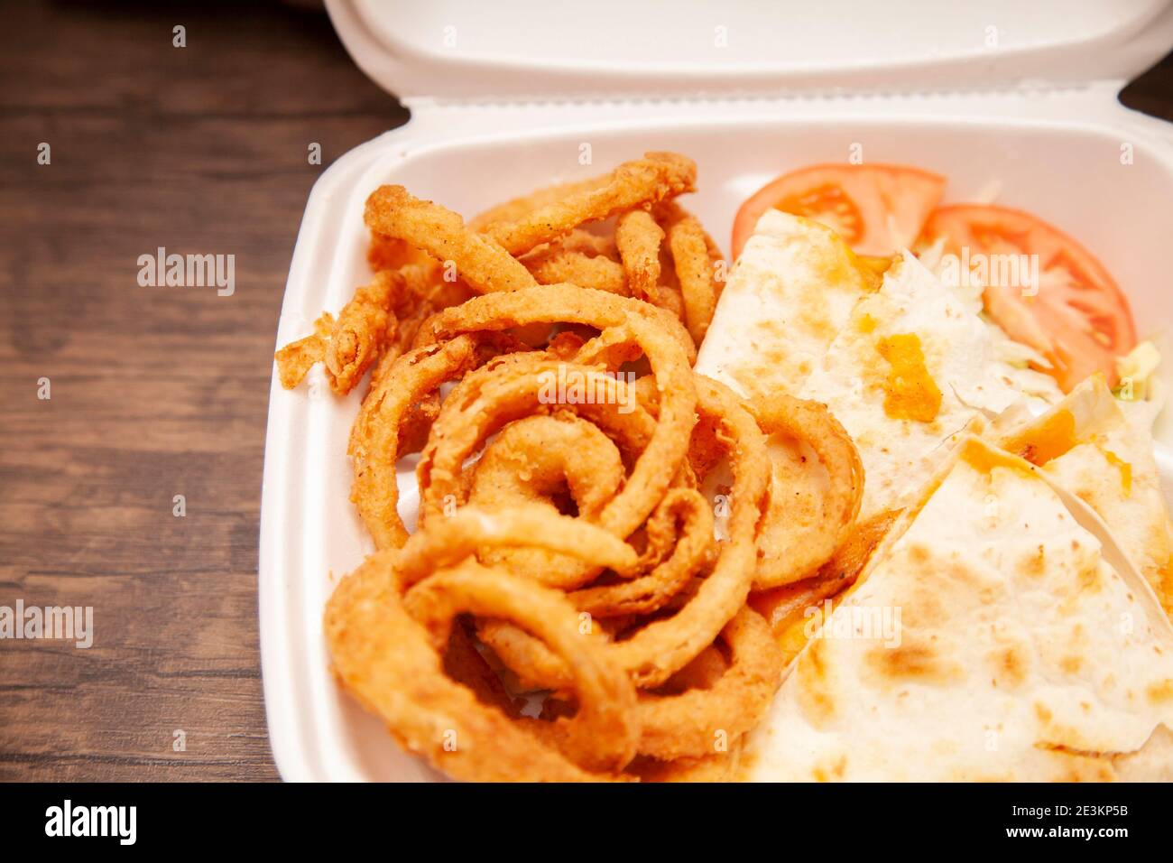 Onion rings in a styrofoam takeout box Stock Photo - Alamy