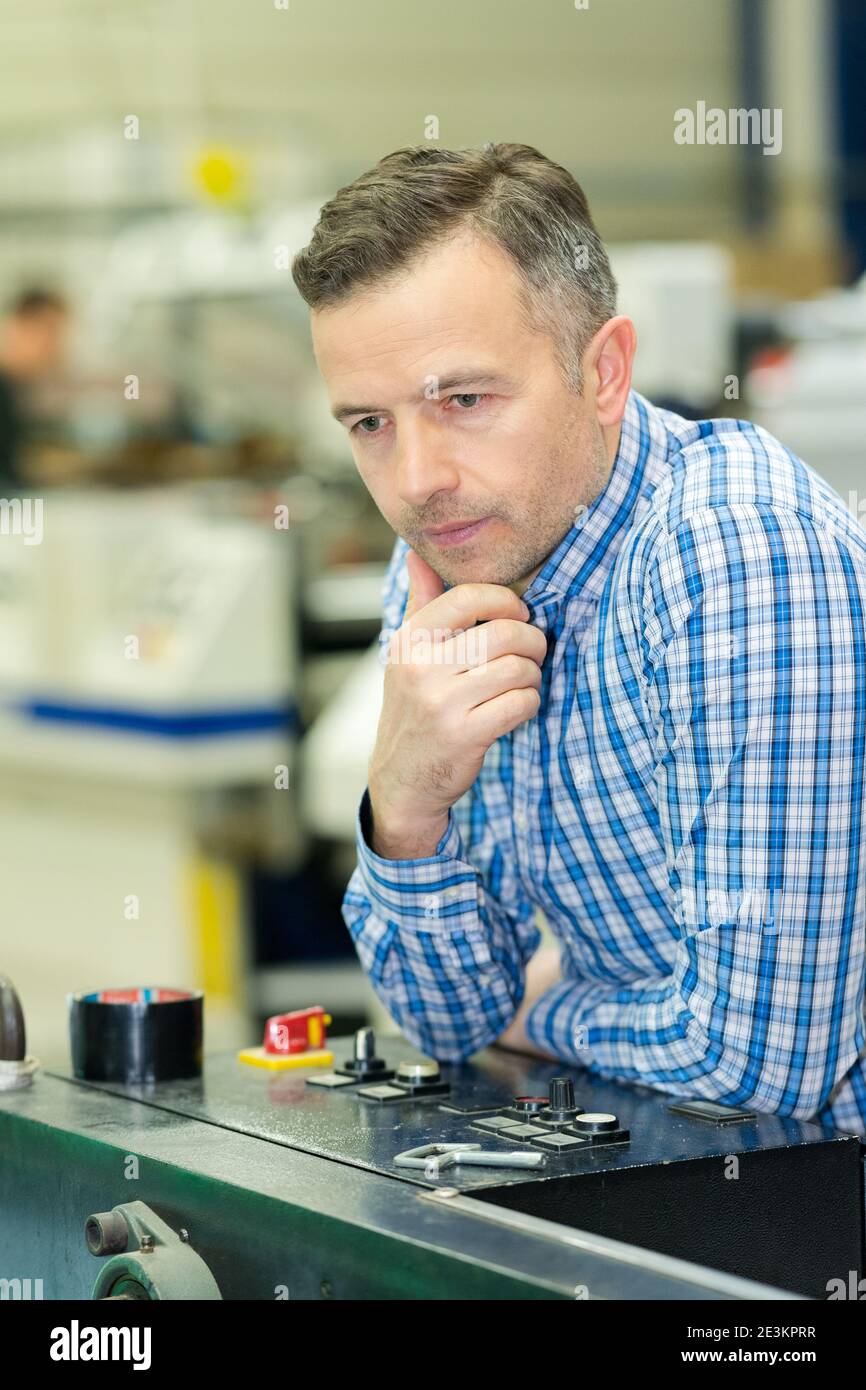 mechanical engineering worker operates a machine Stock Photo - Alamy