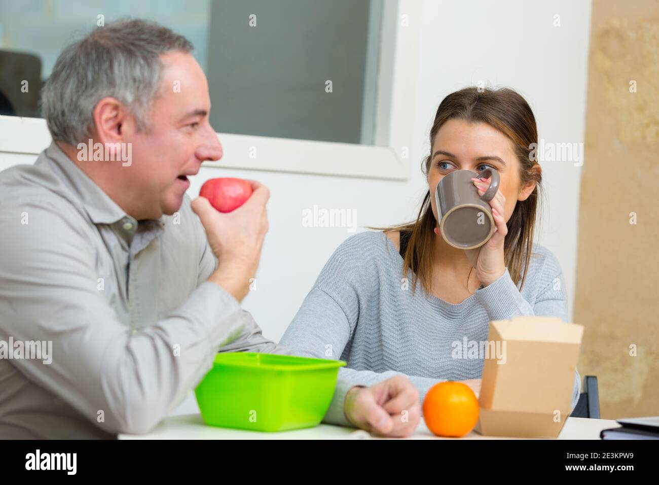 work team having lunch break Stock Photo - Alamy