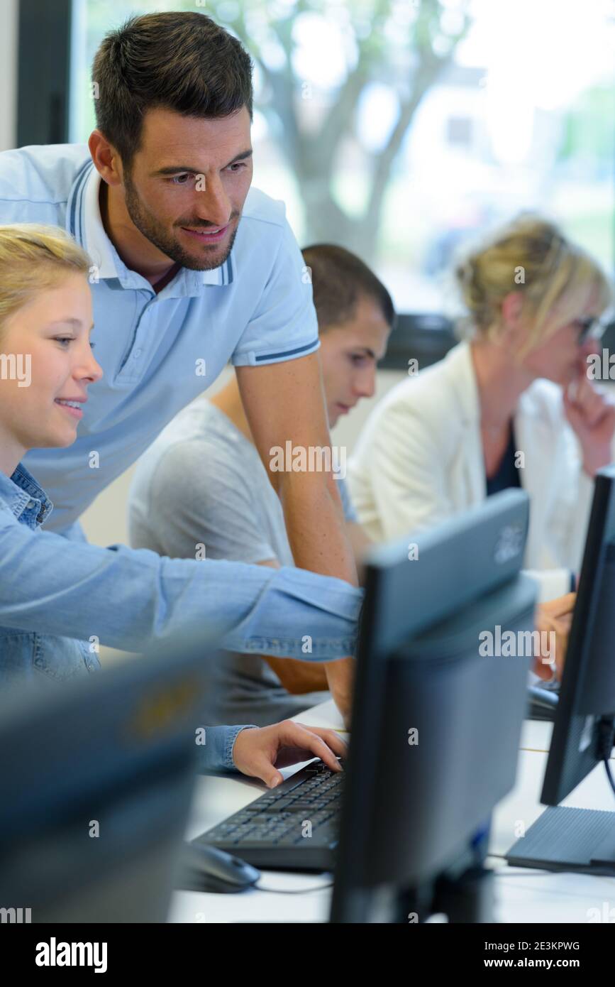 two students working on computers in classroom Stock Photo - Alamy