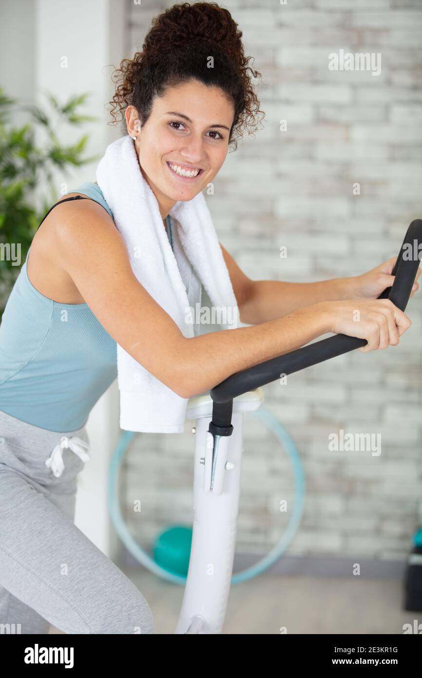 slim young woman exercising on step machine Stock Photo - Alamy
