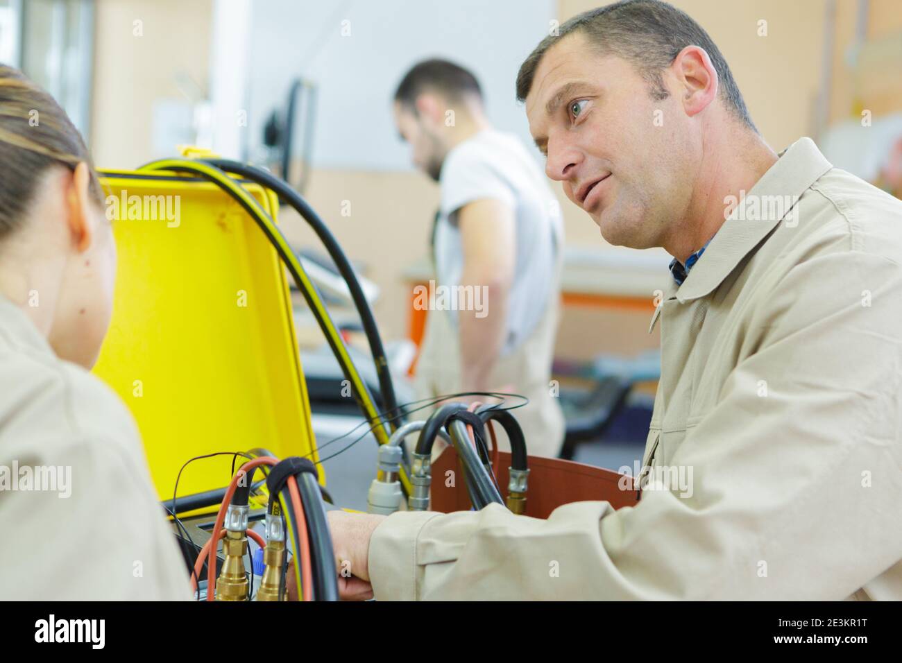 Woman man fixing object hi-res stock photography and images - Alamy