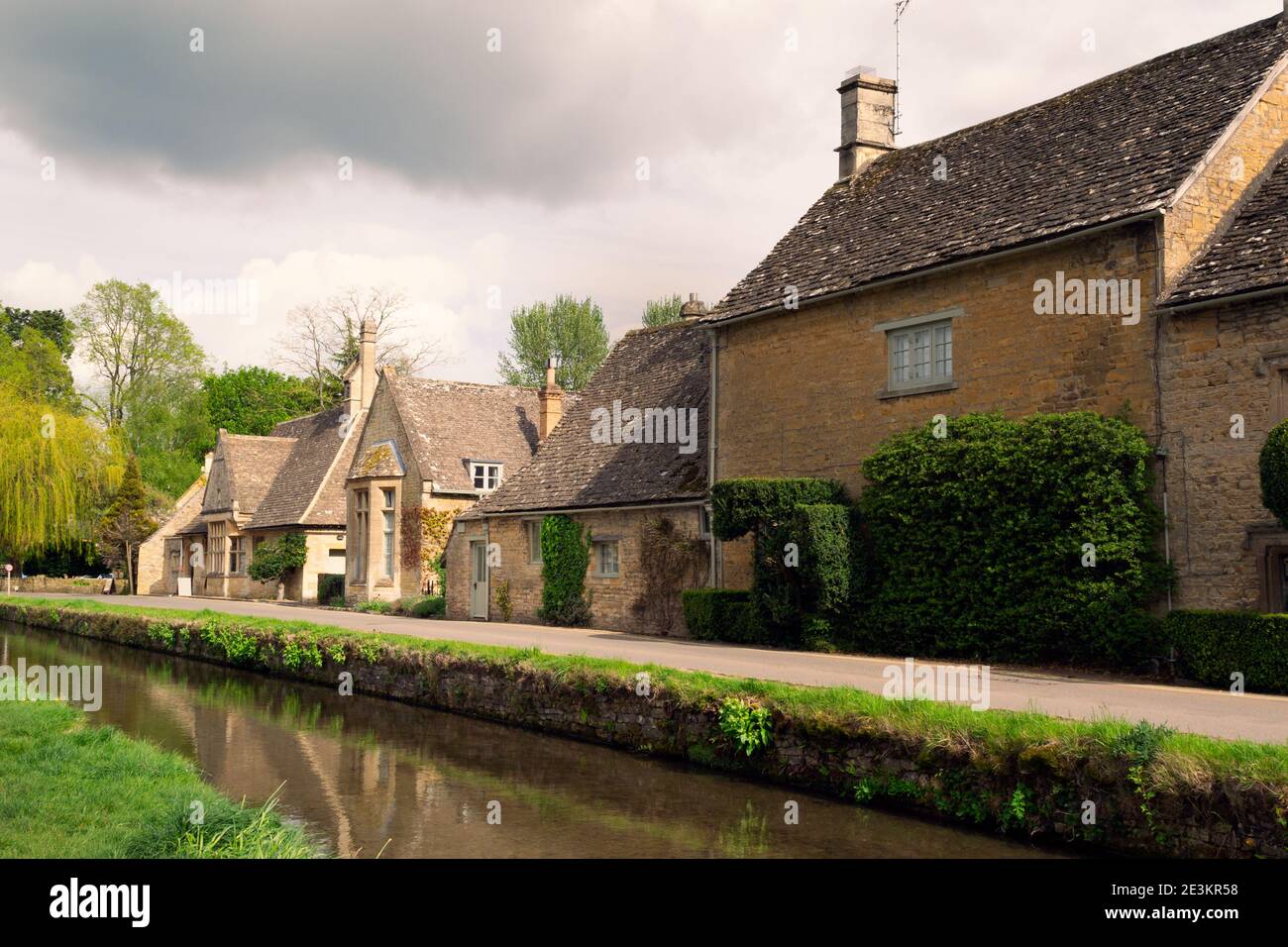 LOWER SLAUGHTER, ENGLAND - APRIL 28th, 2019 : The river Eye and some ...