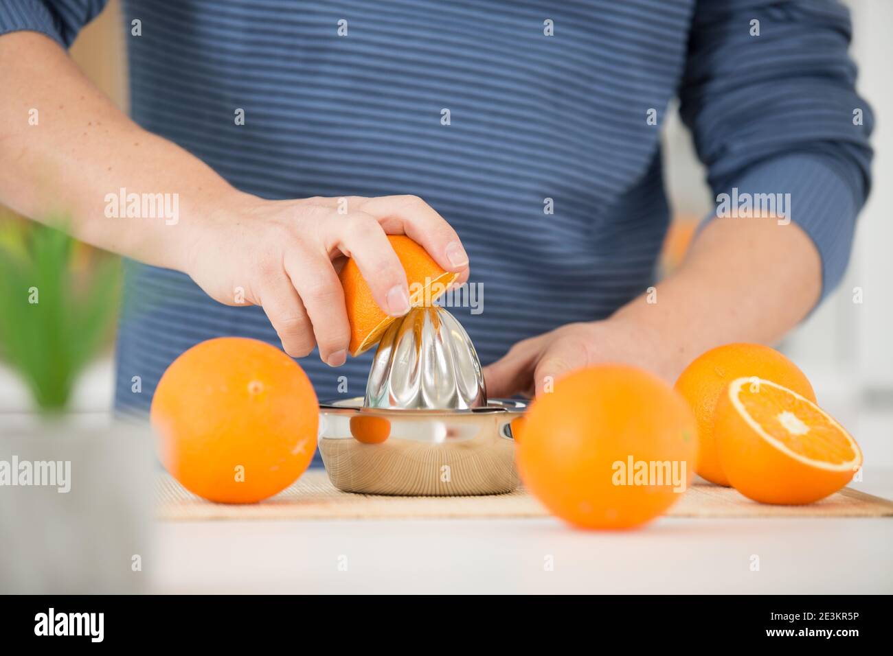 Hands man squeezing orange hi-res stock photography and images - Alamy