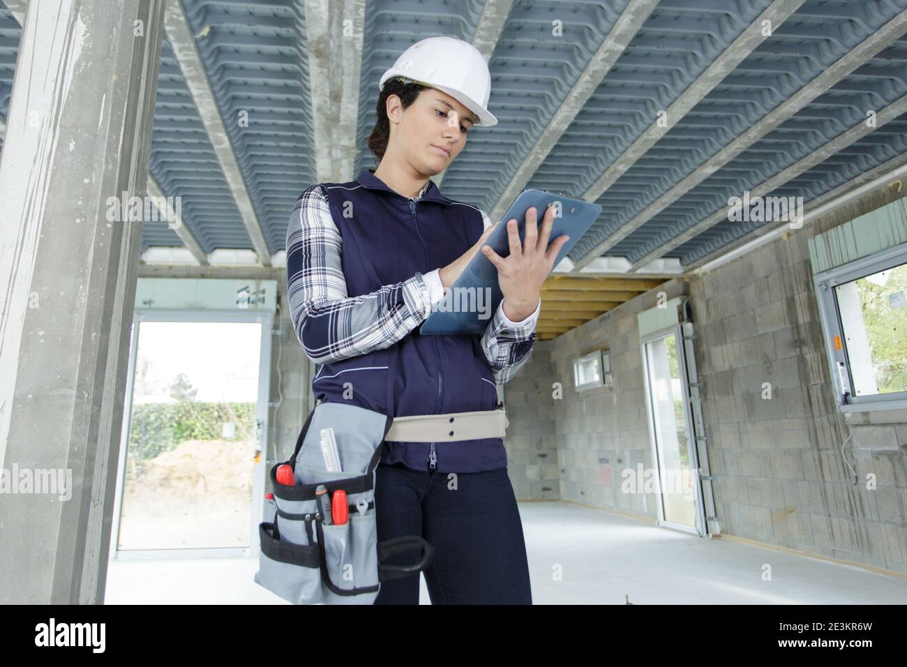 Woman carpenter making notes hi-res stock photography and images - Alamy
