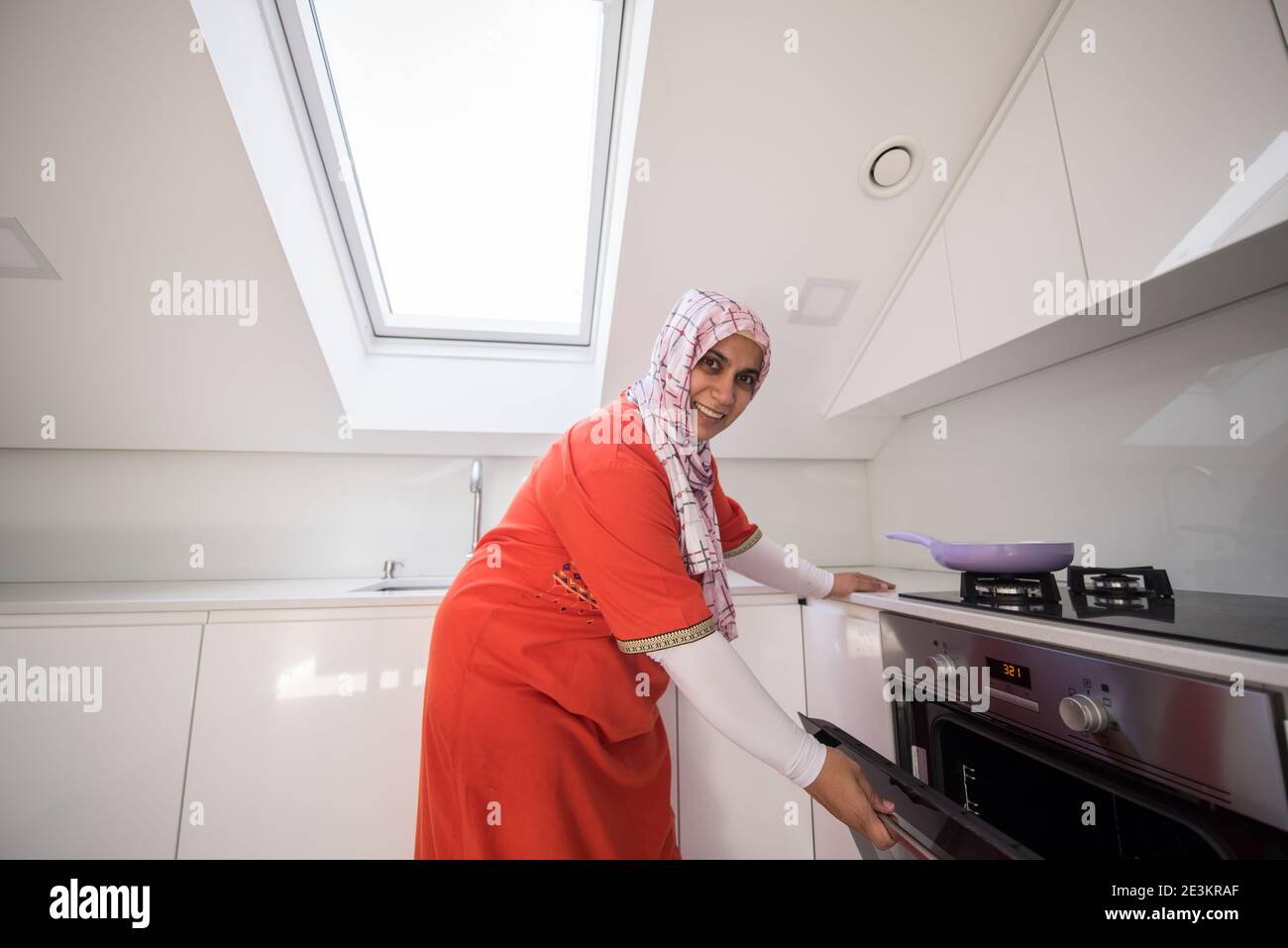 Muslim traditional woman using stove Stock Photo - Alamy