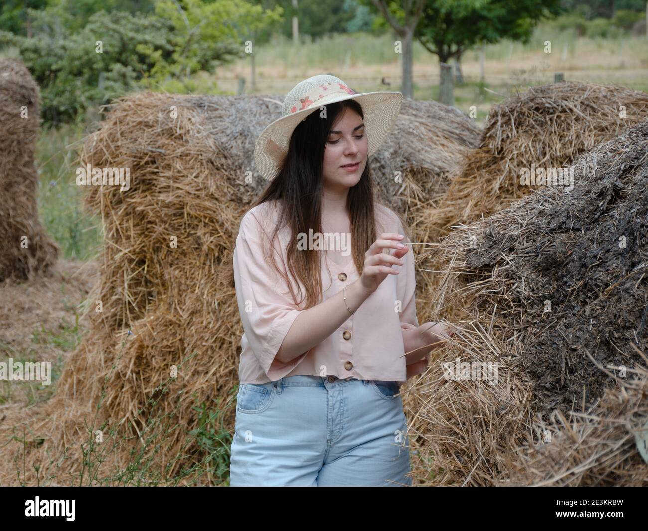 Portrait girl straw hat playing hi-res stock photography and images - Alamy