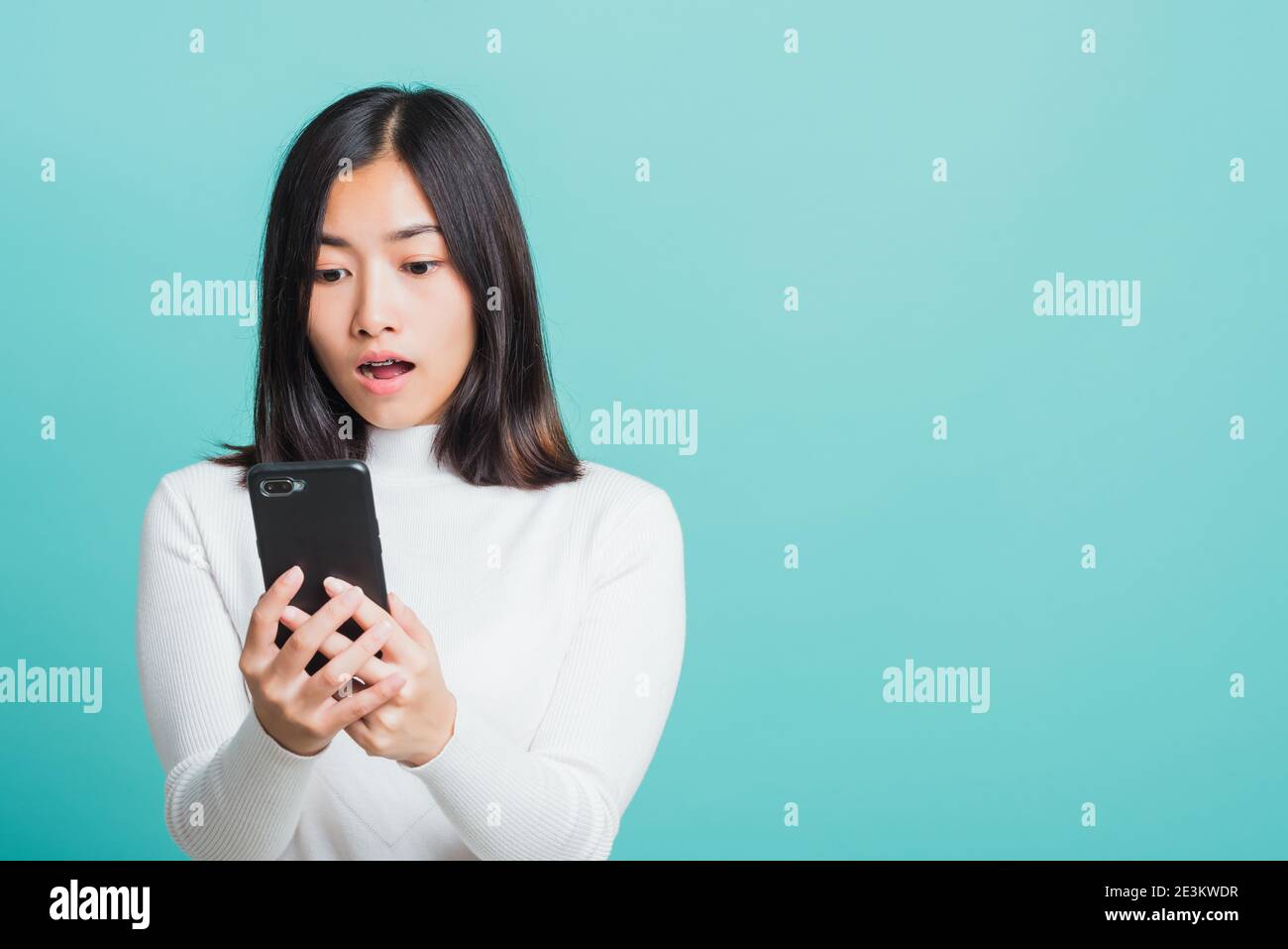 Portrait female anxious scared on the phone seeing bad news, Young ...
