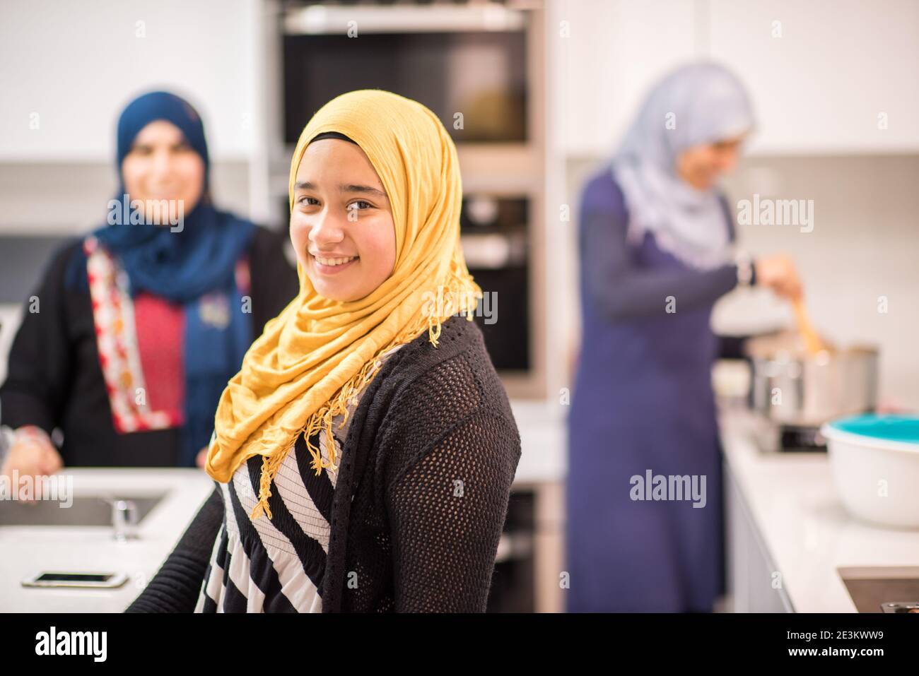 Group female hijab food table hi-res stock photography and images - Alamy
