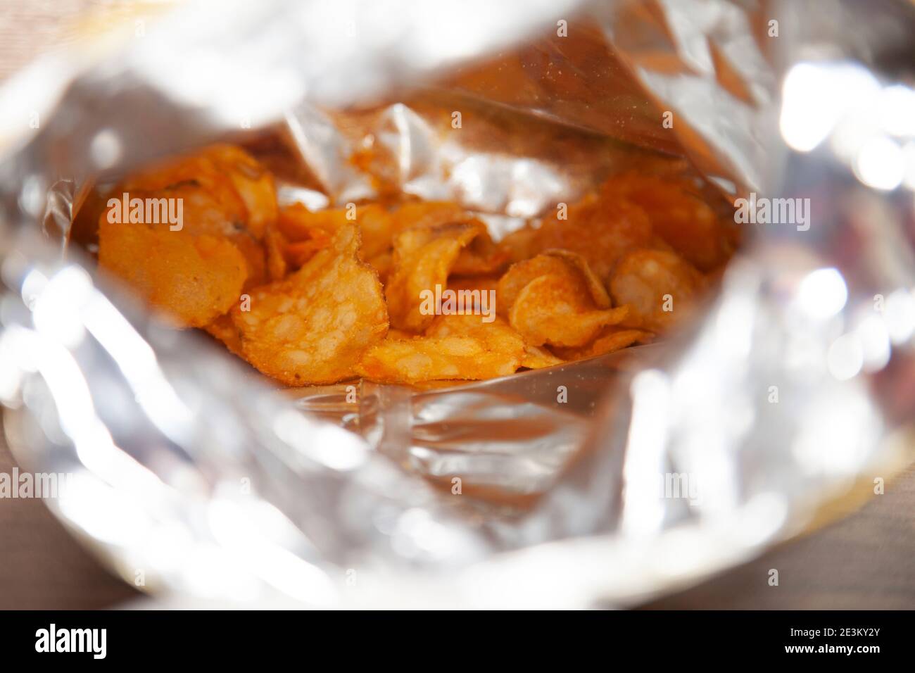 Flavored potato chips at the back of an open bag Stock Photo - Alamy