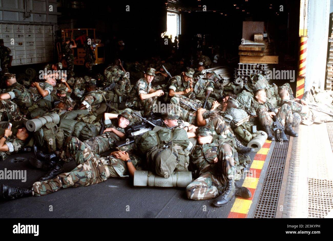 Marines relaxing on the hangar deck of USS Guam (LPH-9), 1991 Stock ...