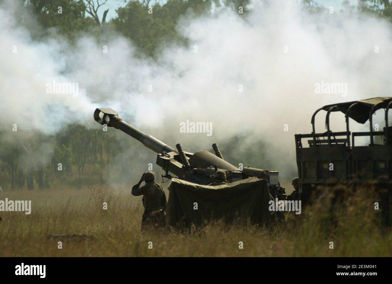 Marines perform a live fire exercise with the M-198 155 mm howitzer in ...