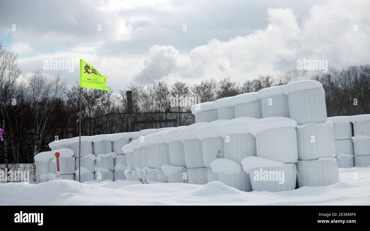 Covered haystacks in a farmland in Hokkaido, Japan Stock Photo - Alamy