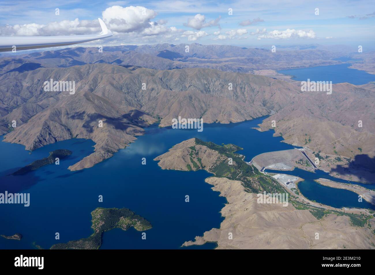 Aerial view of bright blue Lake Benmore in Canterbury landscape through ...