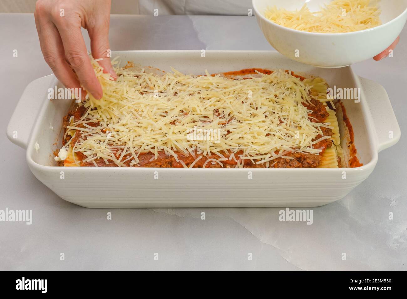 Topping lasagna with parmesan cheese. Step by step beef lasagna recipe ...