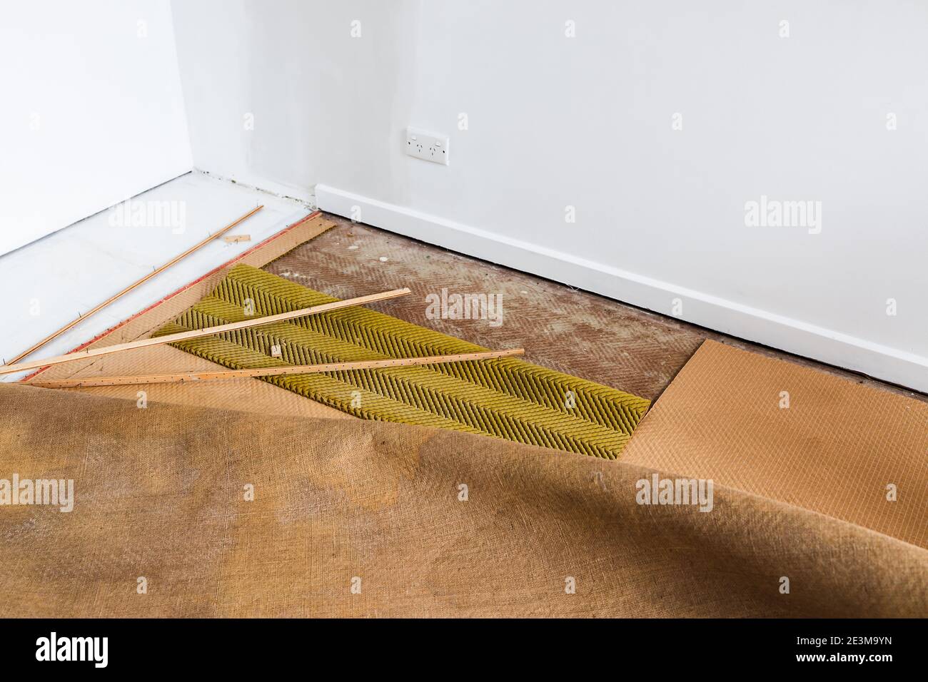 home improvement and DIY concept, ripping up the carpet and underlay ...